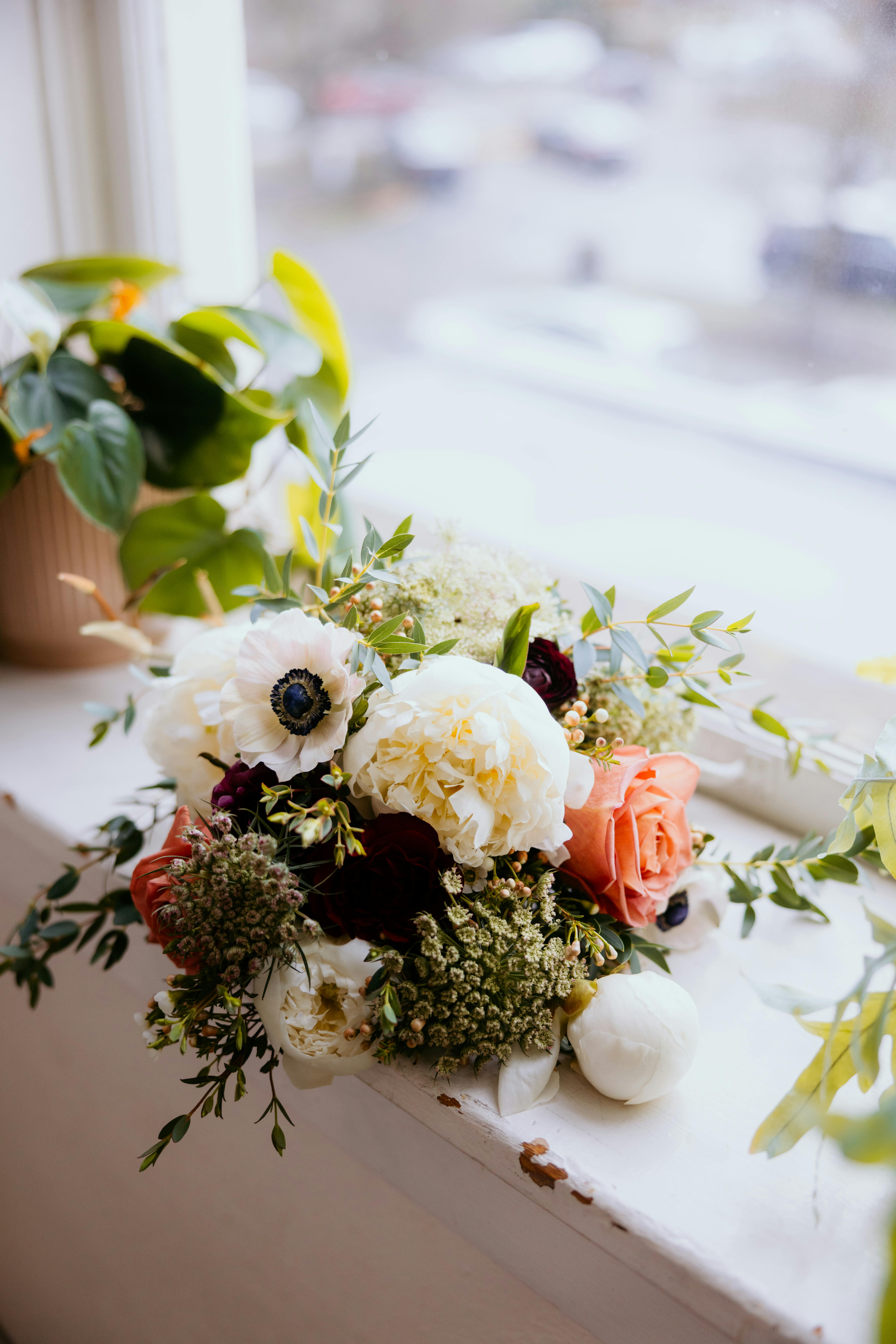 Bright Floral Arrangement on Window Sill · Free Stock Photo
