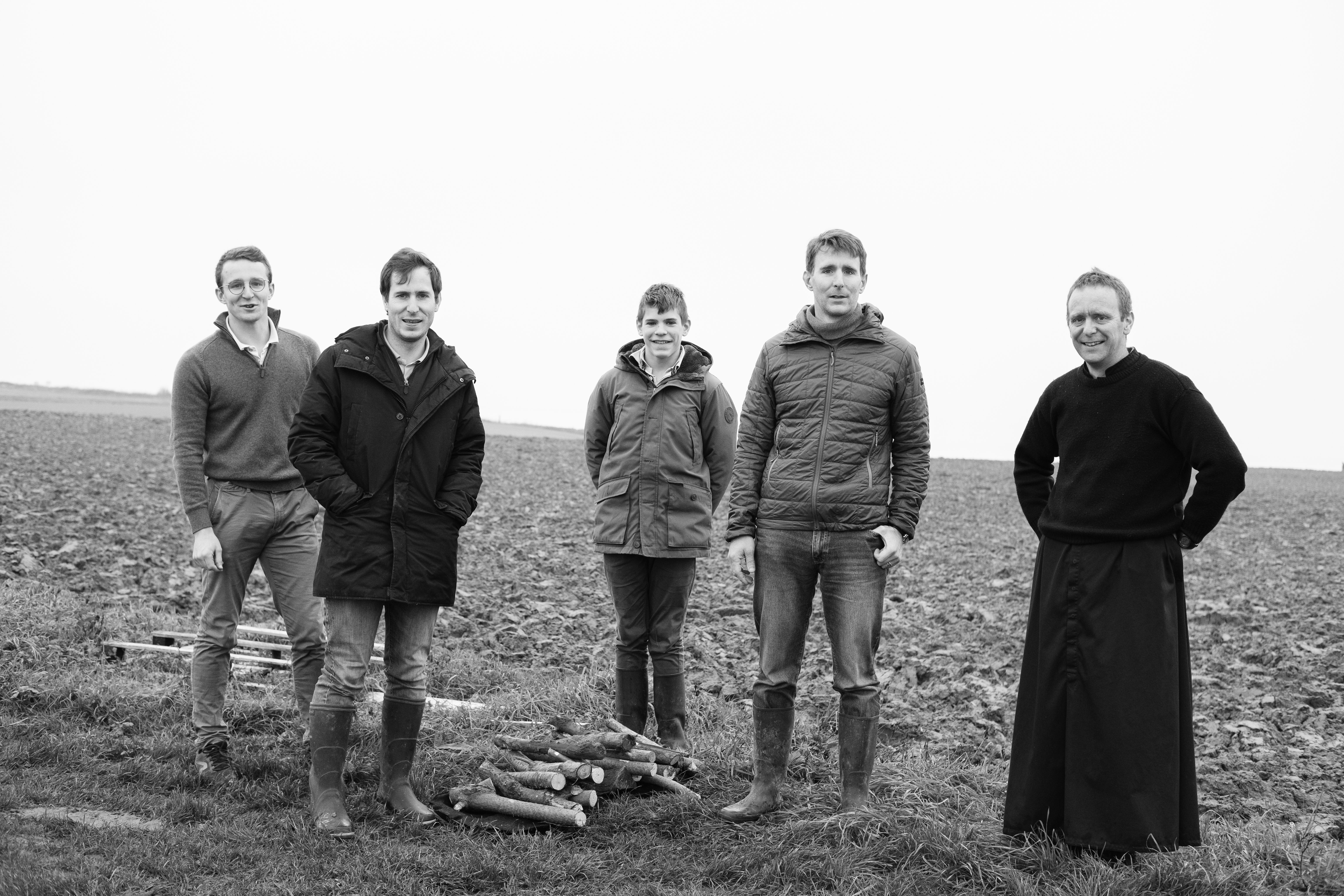 Group Portrait of Men on a Farm in Winter · Free Stock Photo