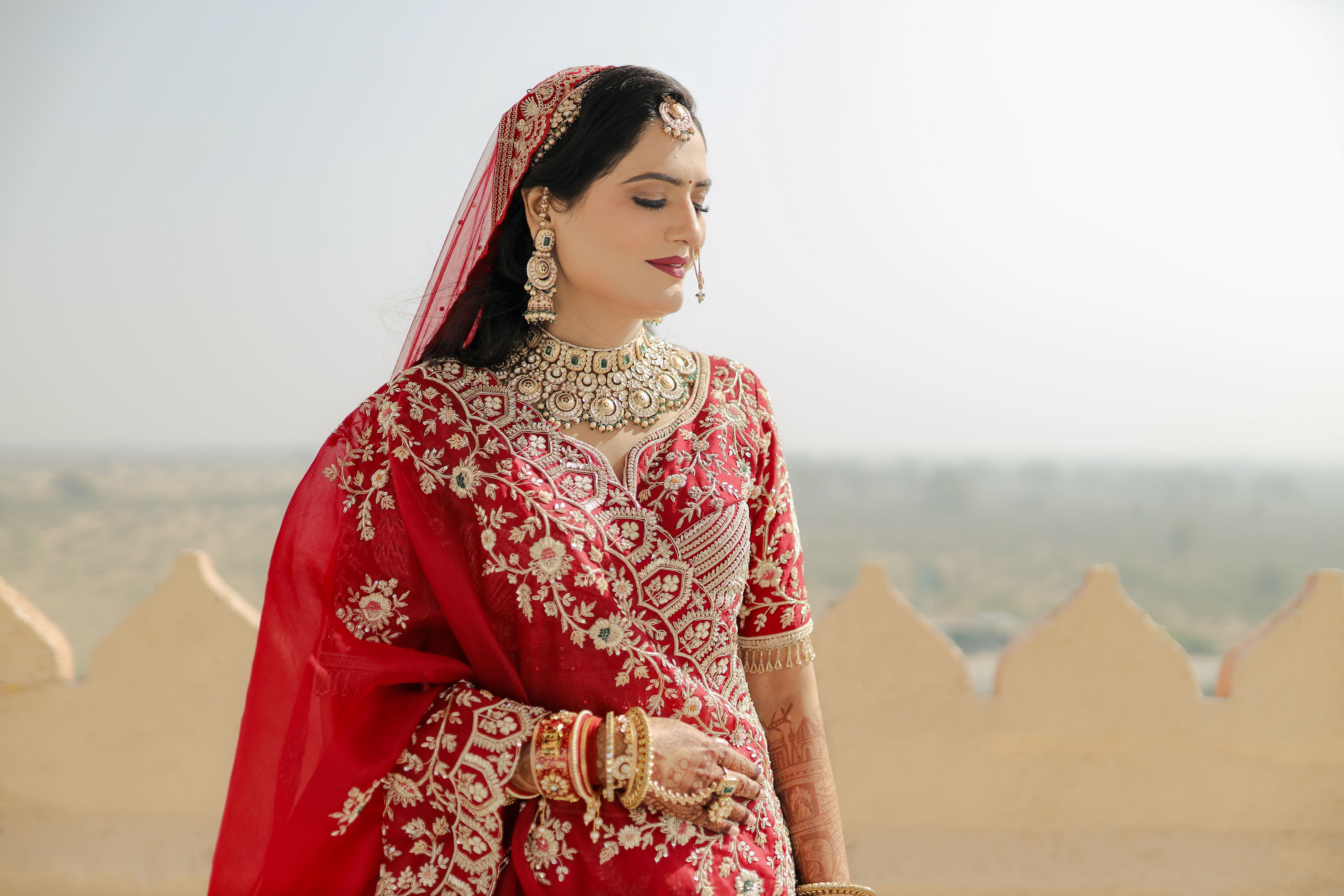 Elegant Indian Bride in Traditional Red Lehenga · Free Stock Photo