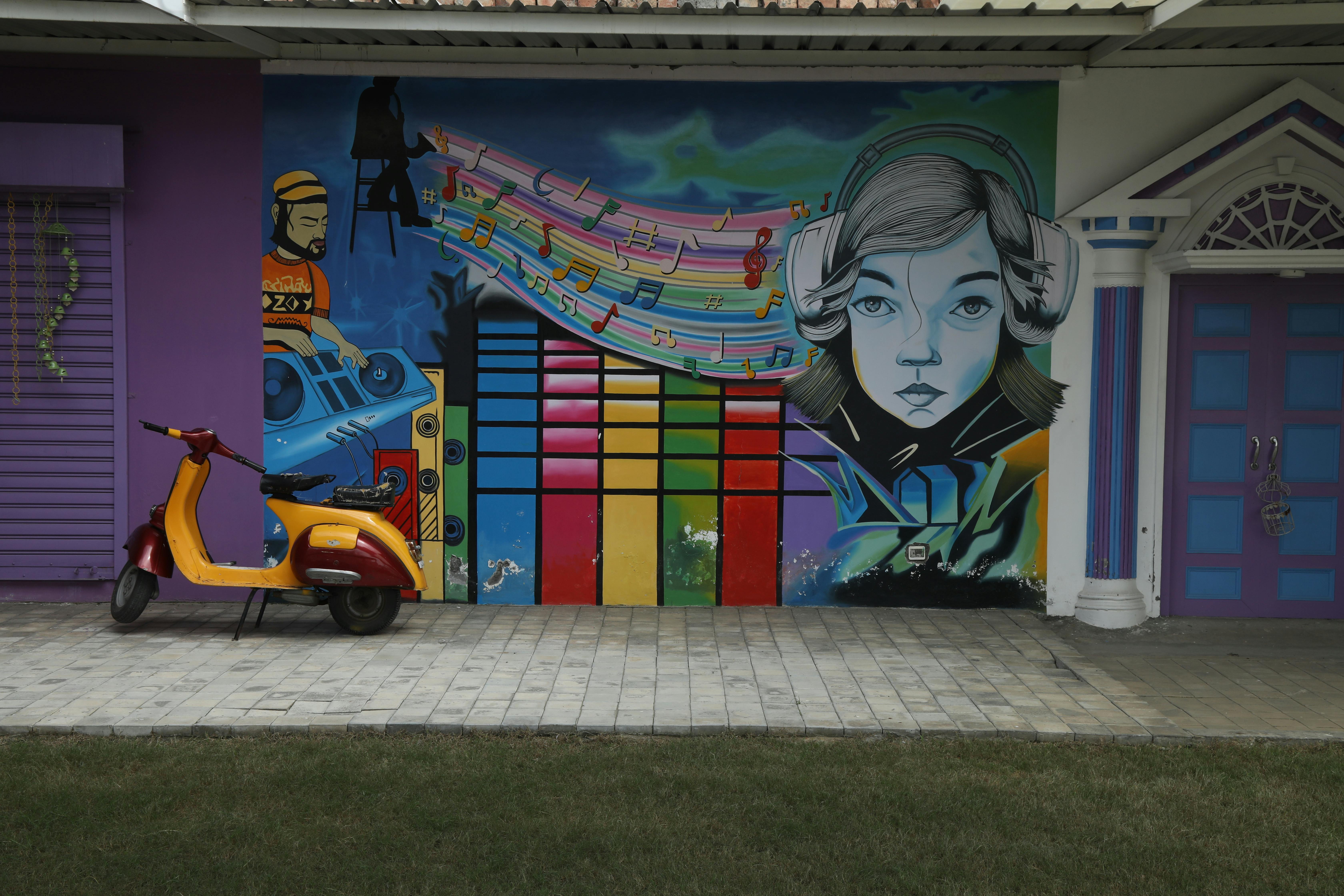 Colorful Urban Wall Mural with Scooter · Free Stock Photo