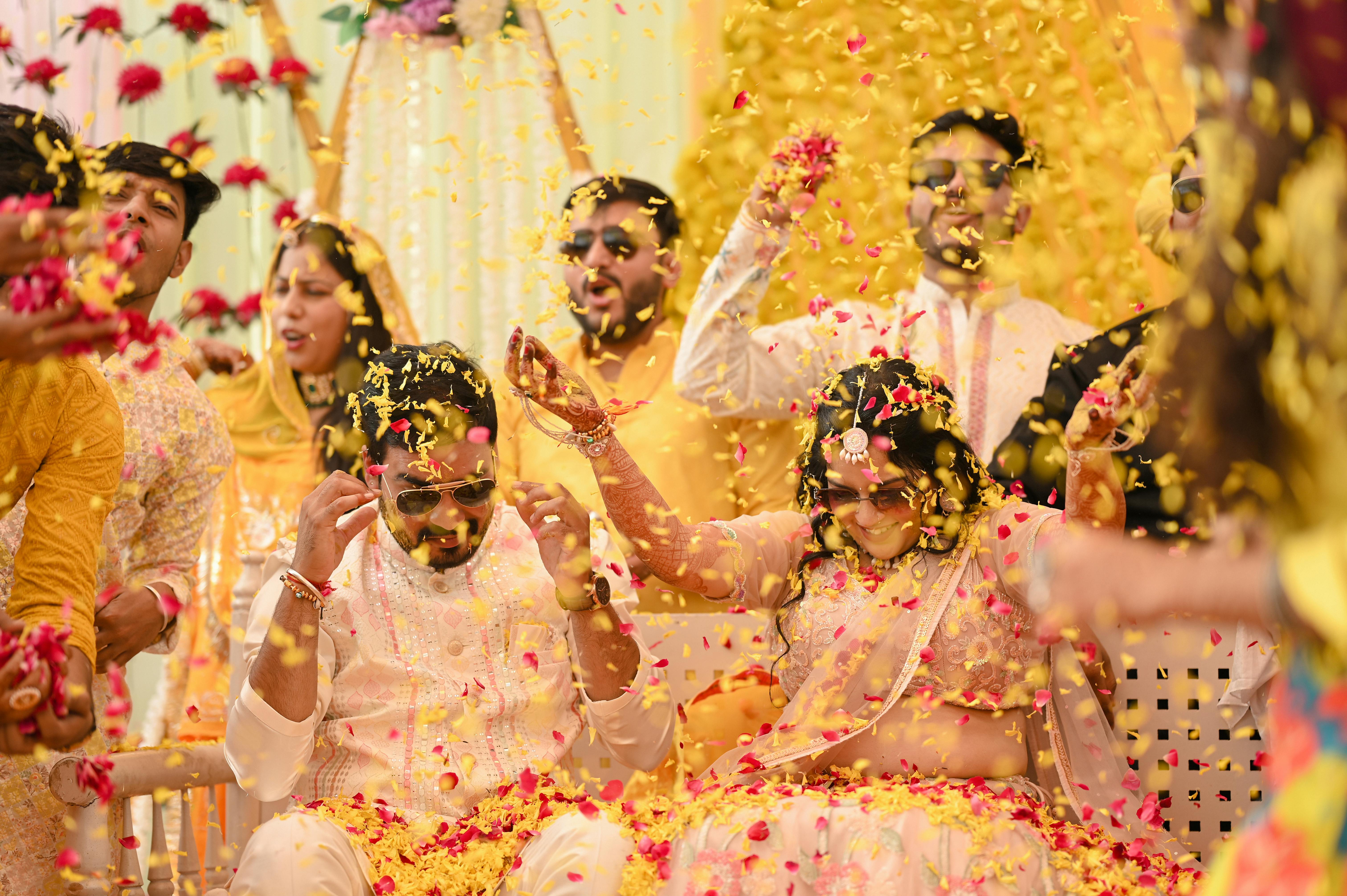 Vibrant Indian Wedding Celebration with Flower Petals · Free Stock Photo