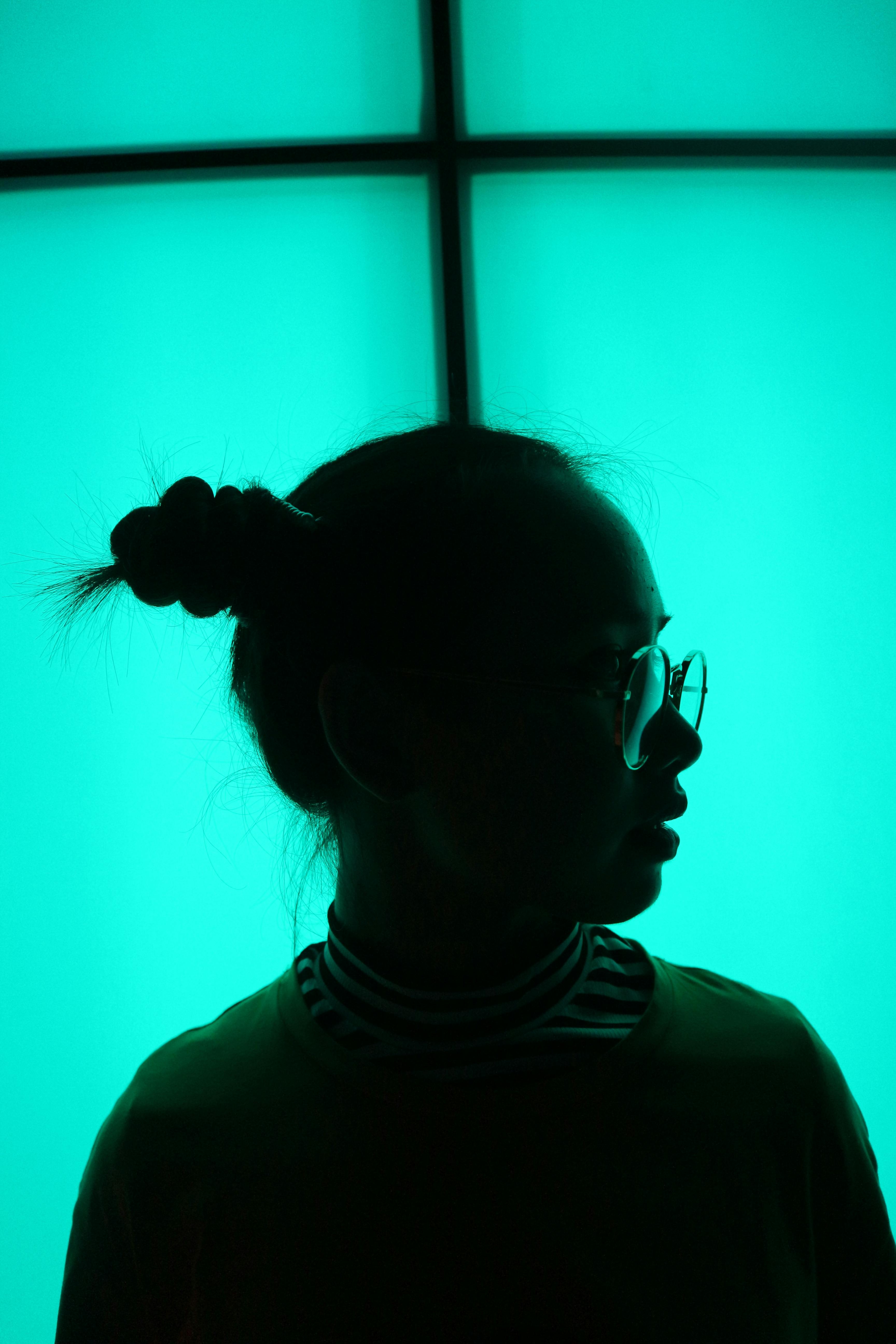 Woman Standing Beside Window · Free Stock Photo