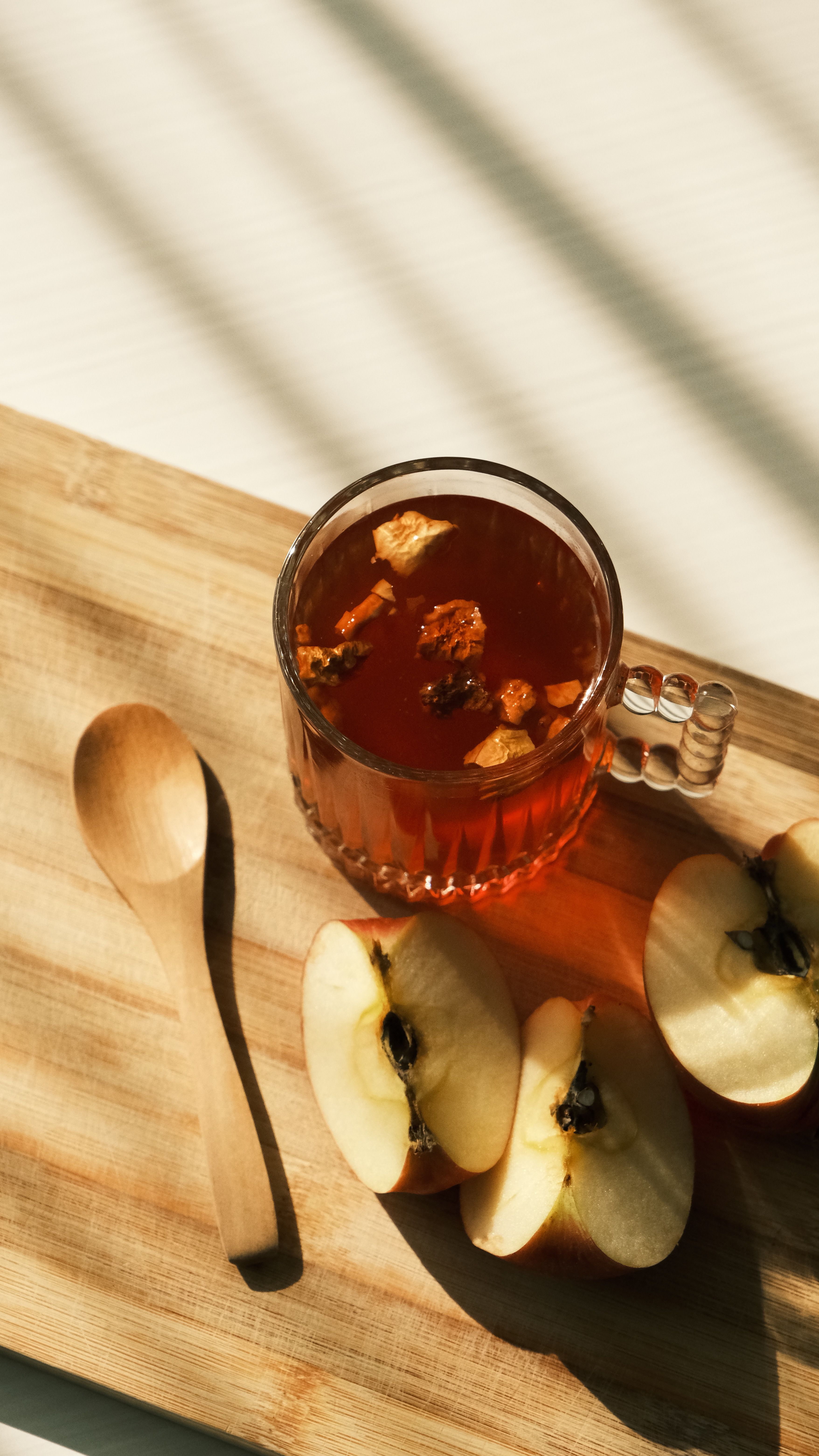 Warm Apple Tea with Sliced Apples and Spoon · Free Stock Photo
