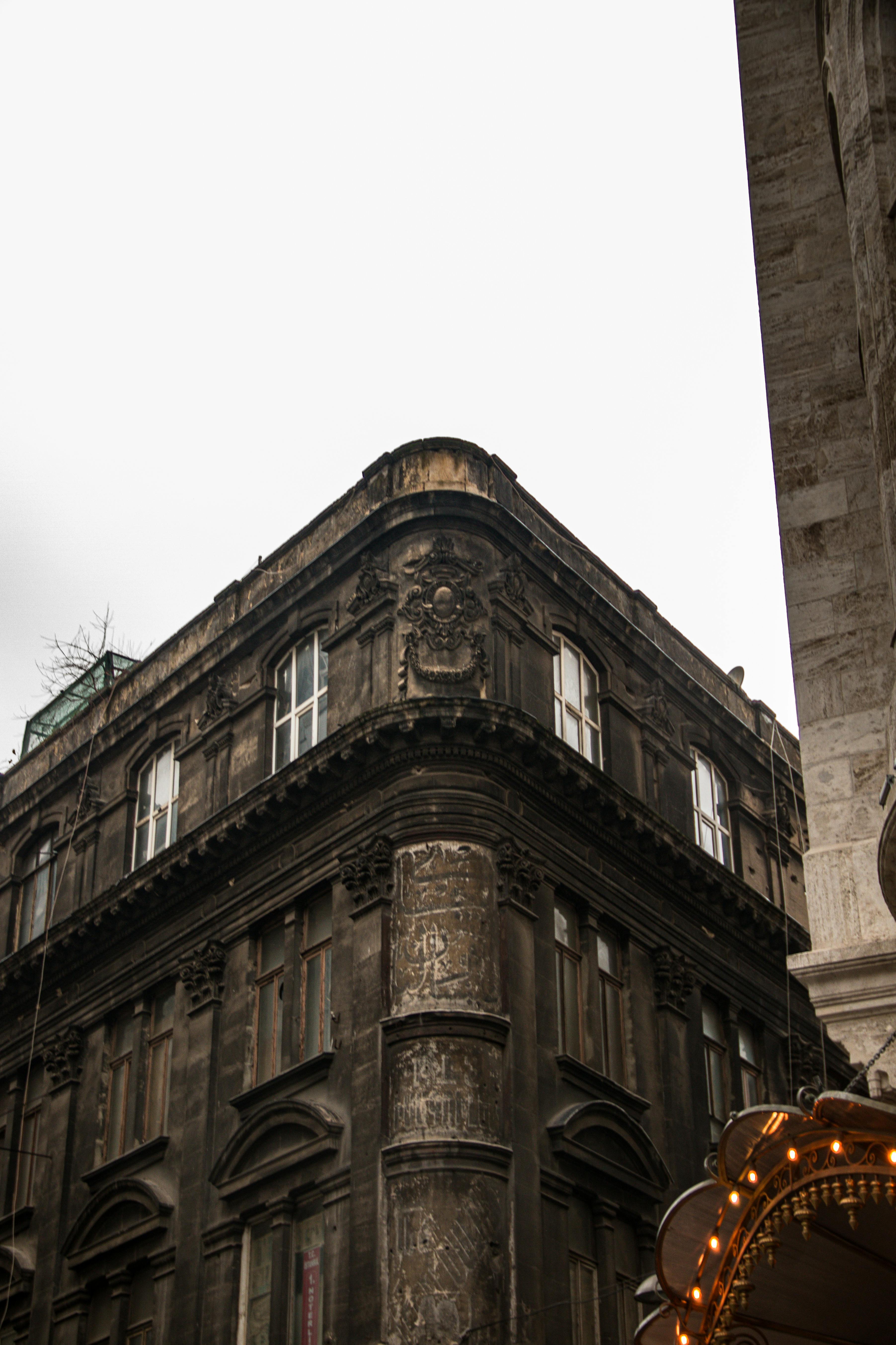 Historic Stone Building with Ornate Facade · Free Stock Photo