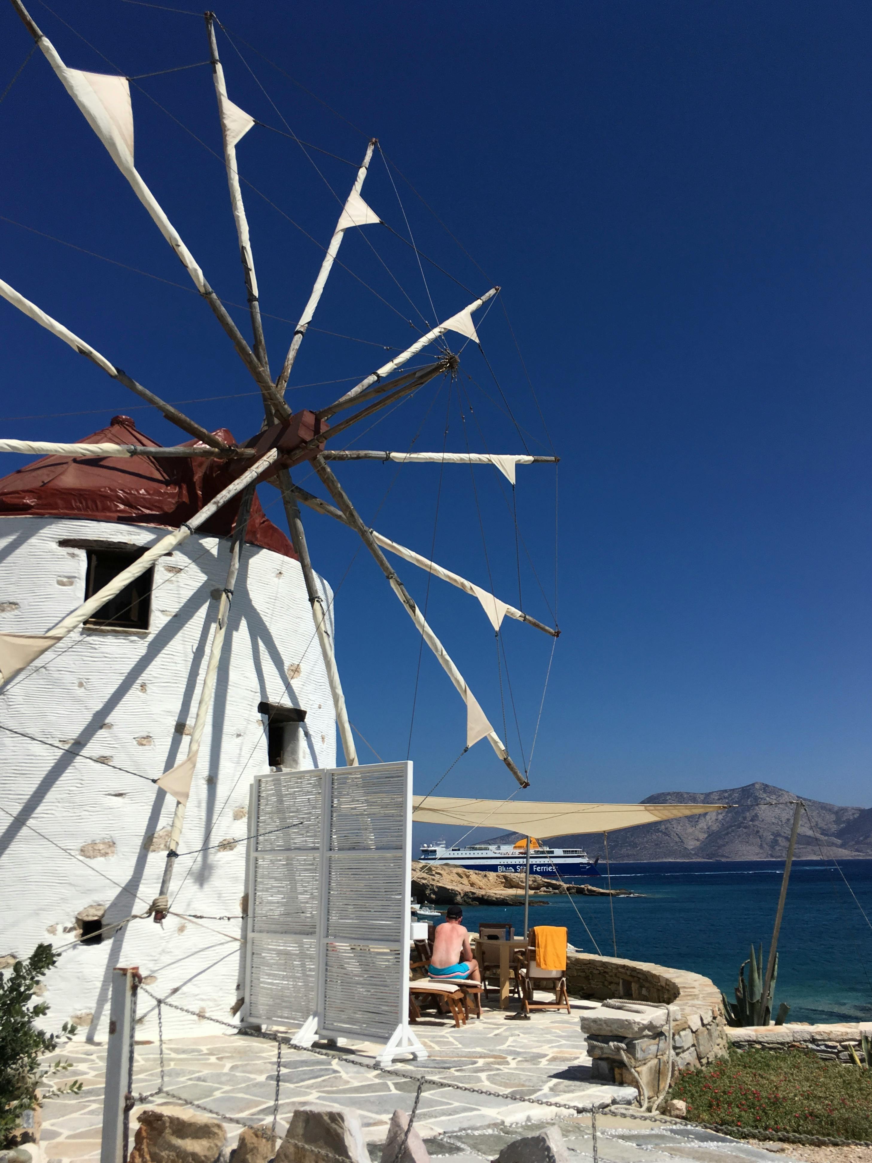 Charming Greek Windmill by the Mediterranean Sea · Free Stock Photo