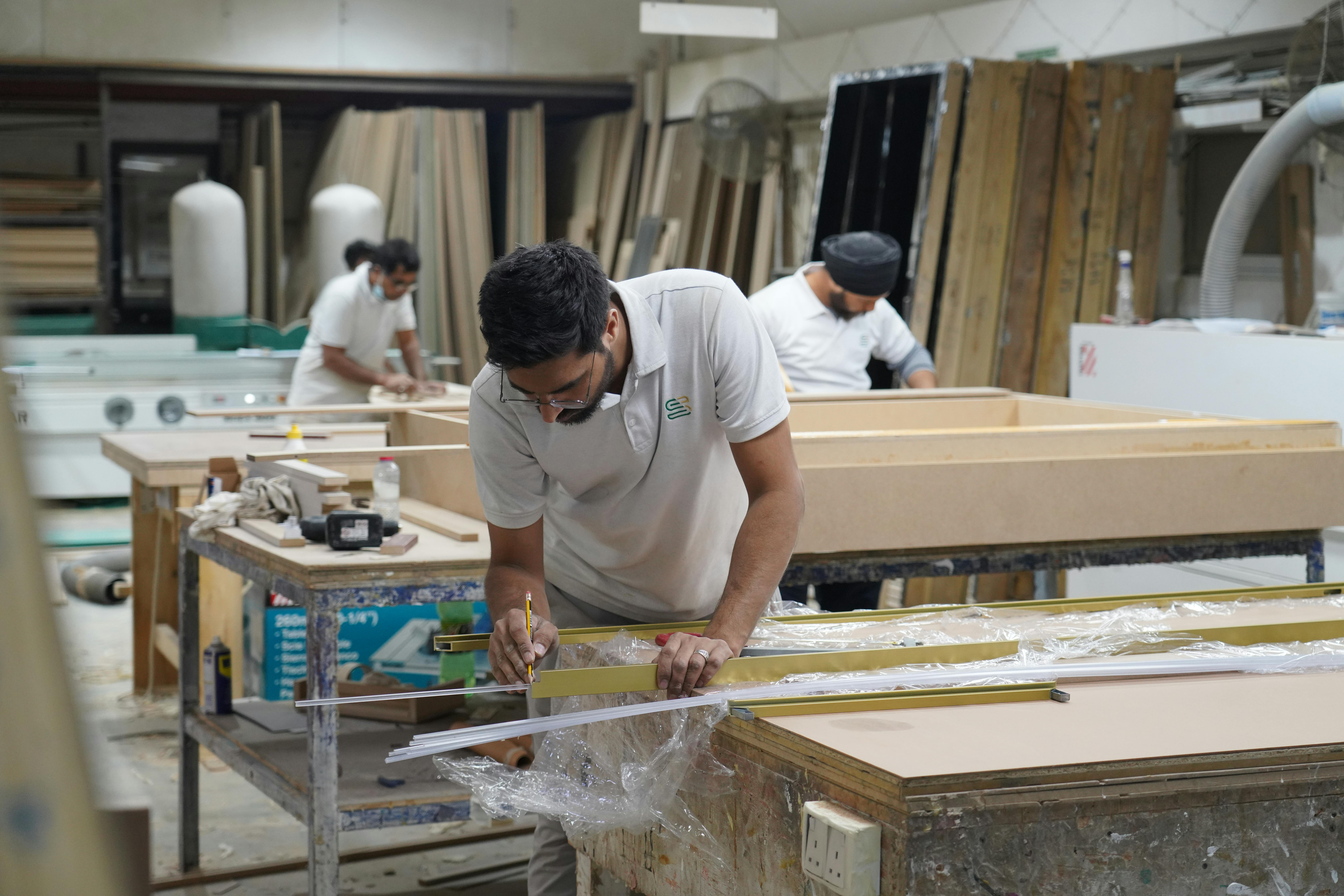 Skilled Carpenters at Work in Dubai Workshop · Free Stock Photo