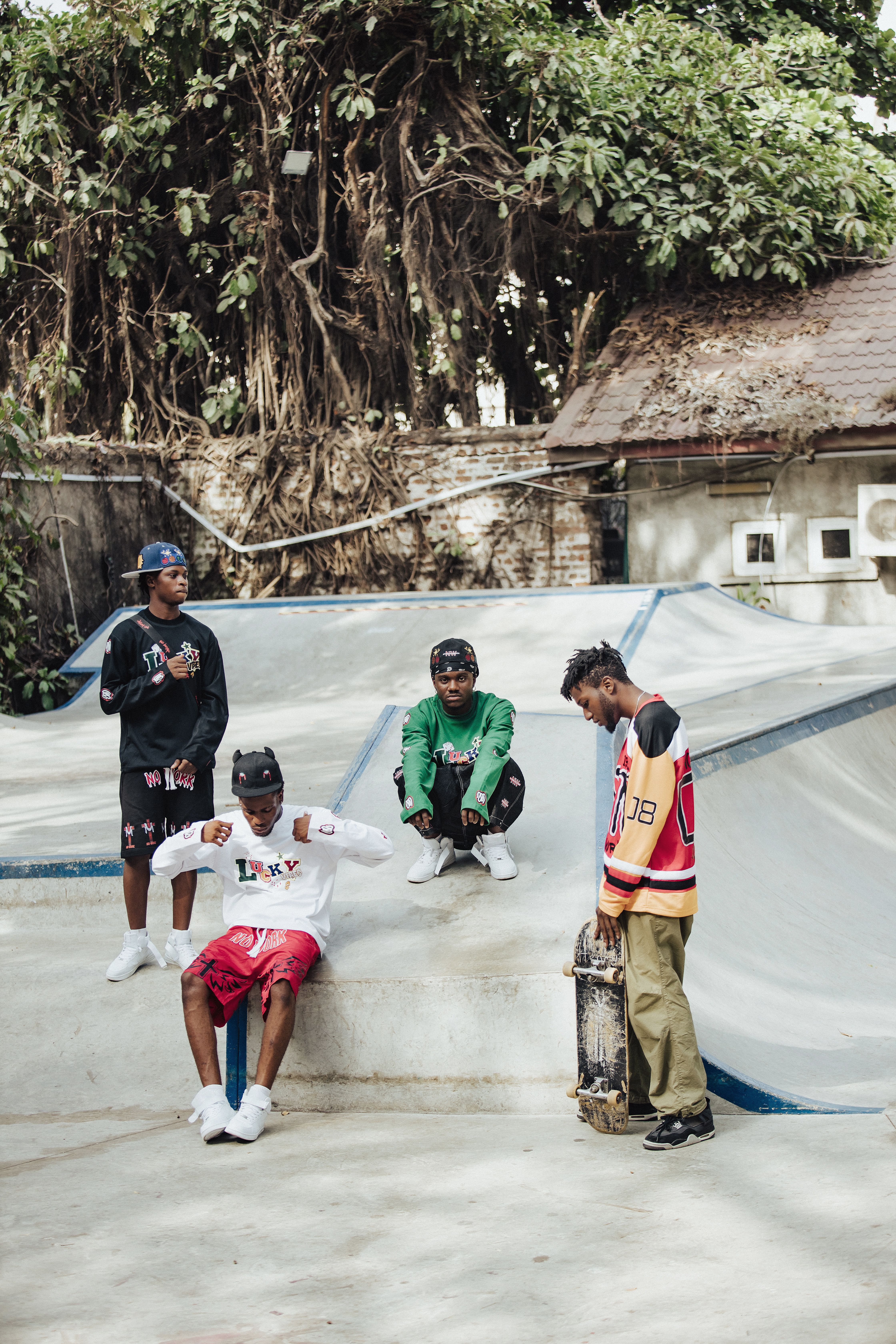 Group of Young Men Relaxing at Skate Park · Free Stock Photo