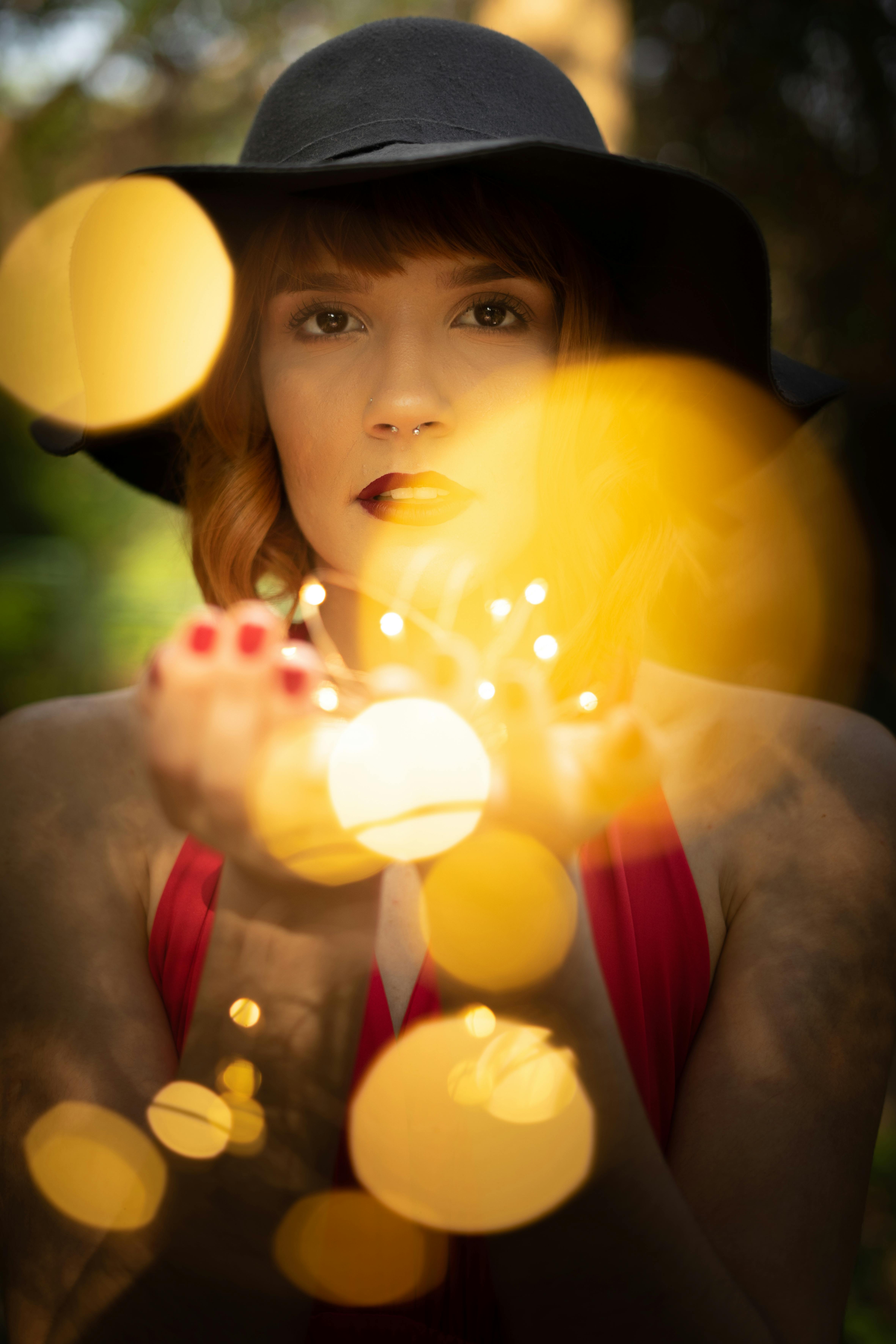 Woman Raising Her Both Arms While Standing Near Wall · Free Stock Photo