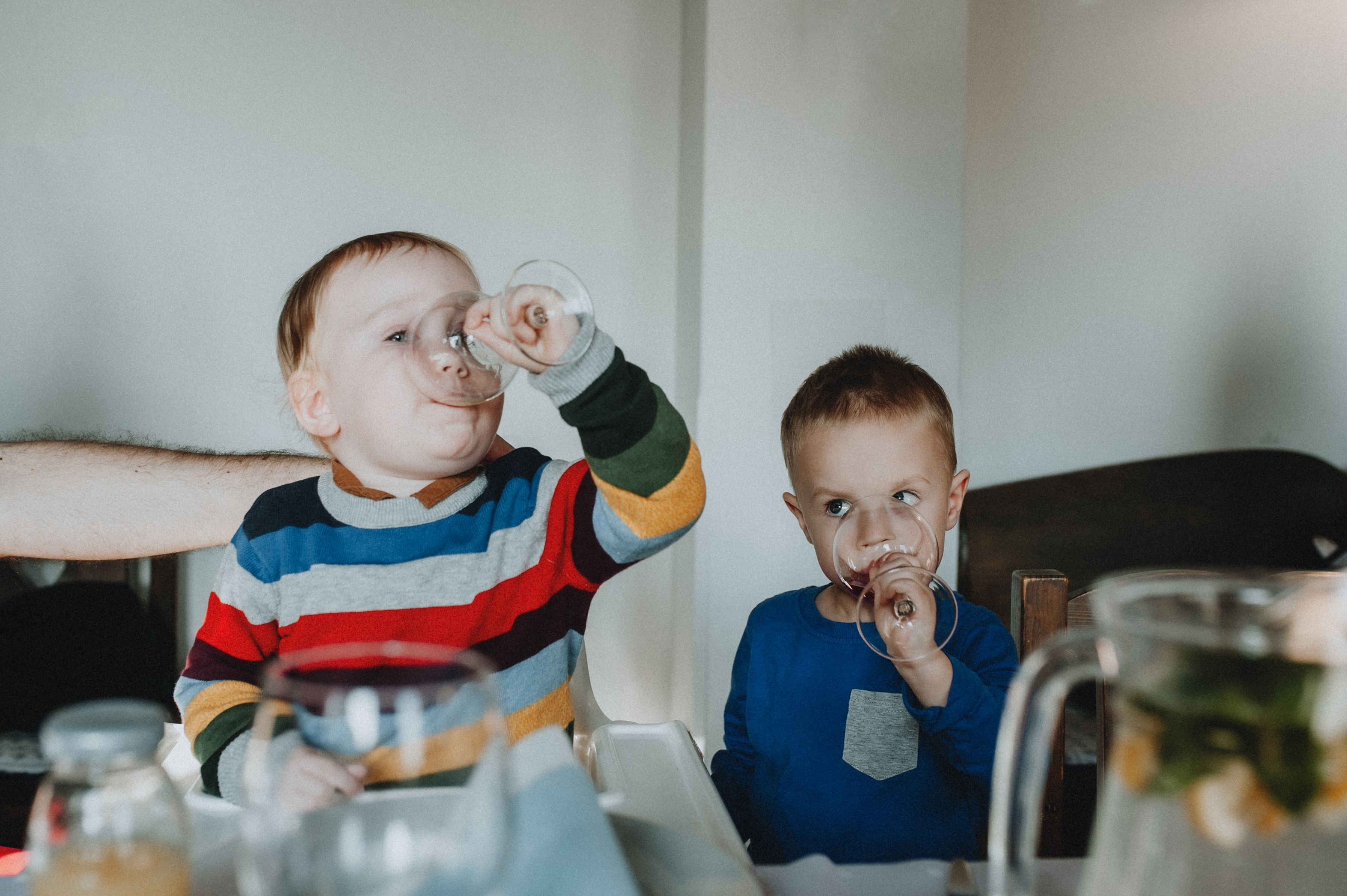 Kids Imitating Wine Tasting at Family Meal · Free Stock Photo