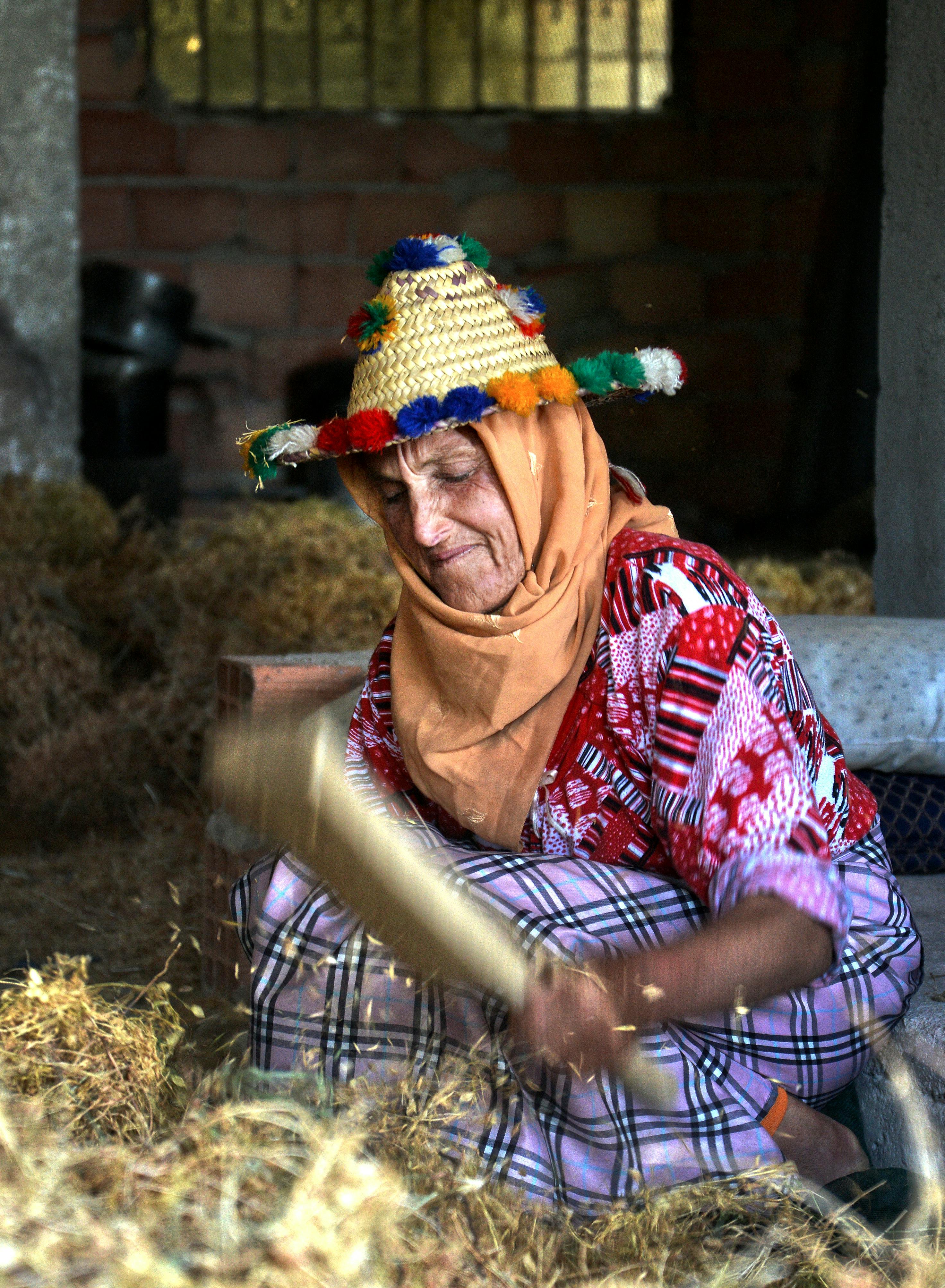 Traditional Moroccan Woman Preparing Hay in Taounate · Free Stock Photo