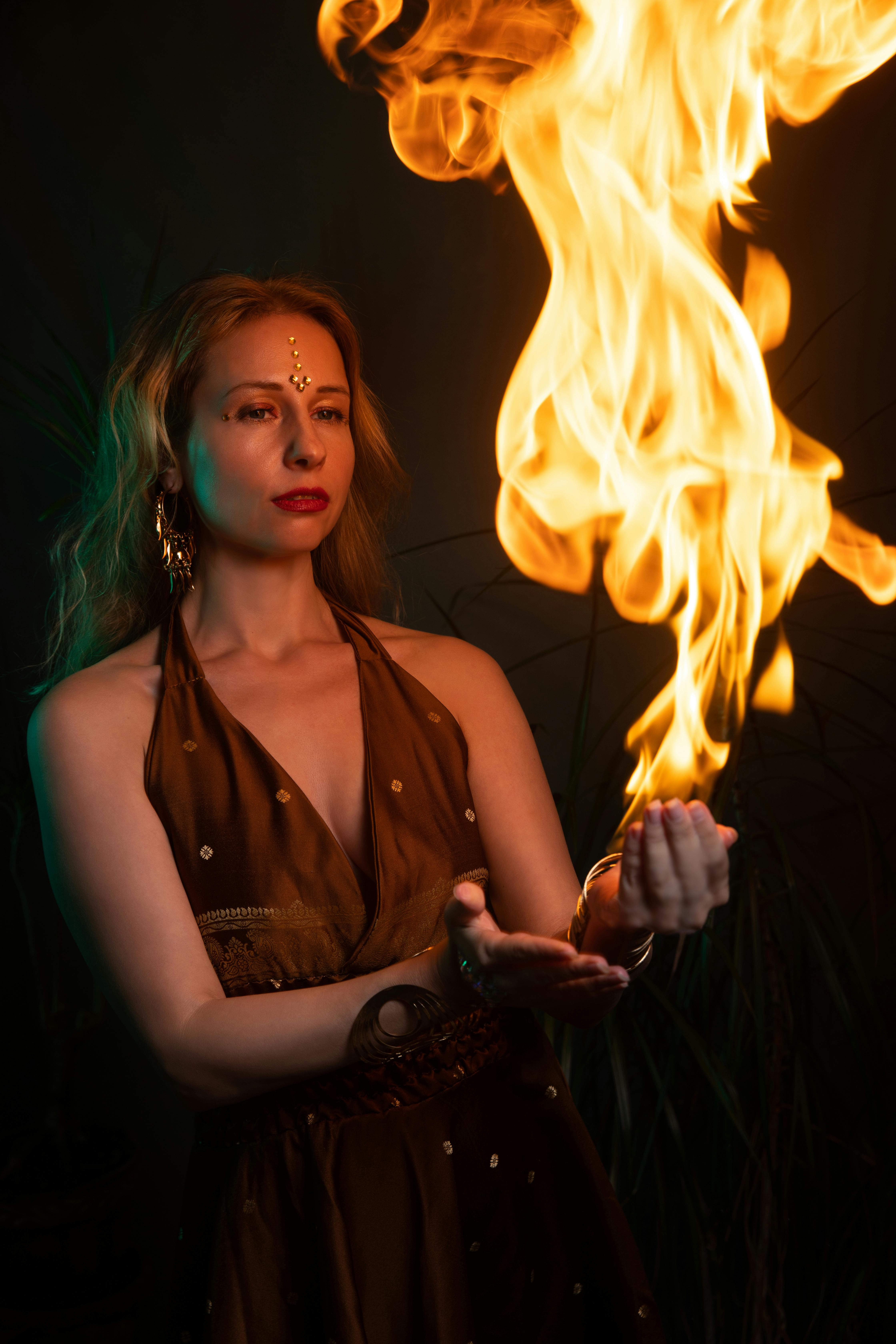 Woman Performing Fire Dance with Flames · Free Stock Photo