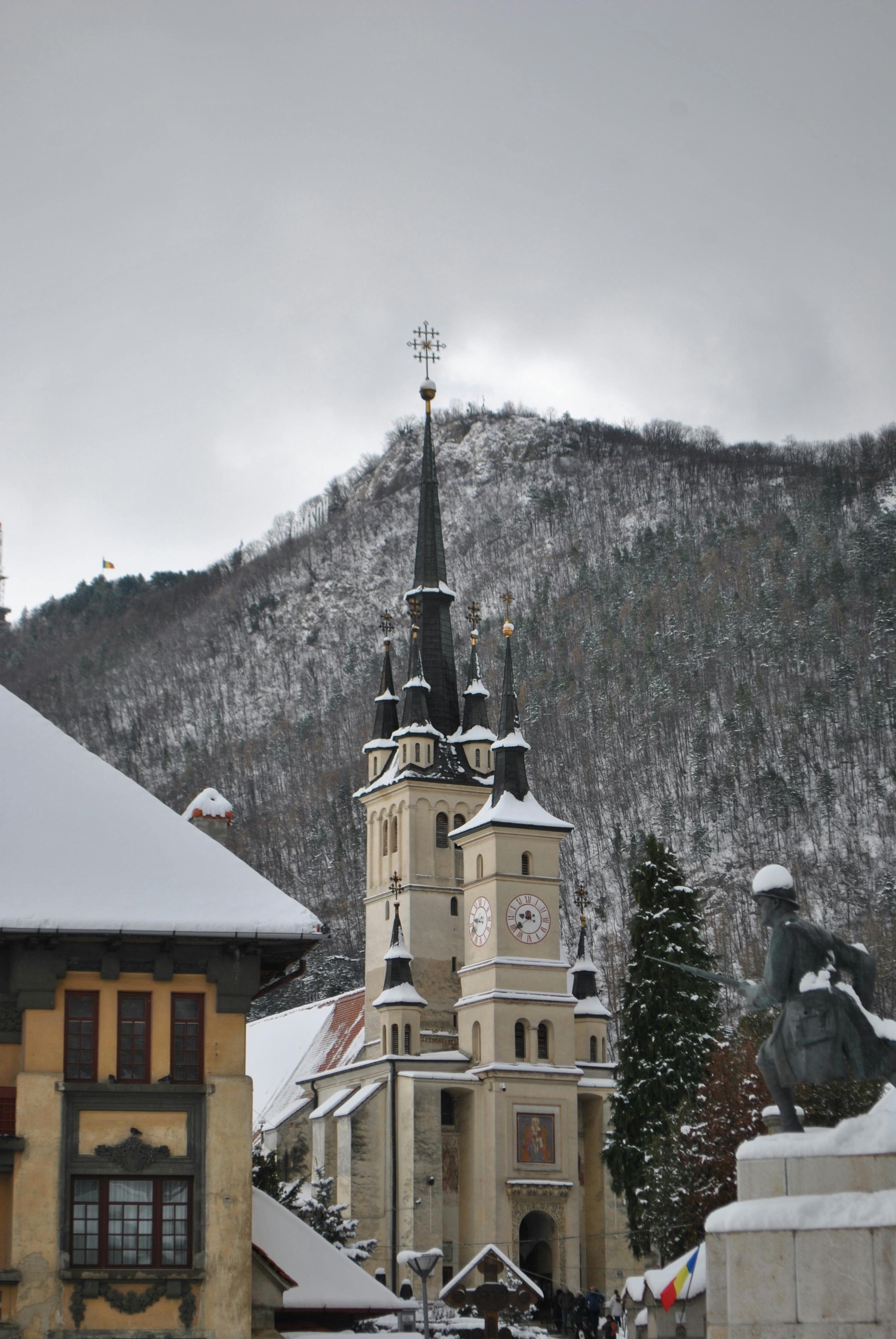 Gothic Church Amid Snowy Mountains in Romania · Free Stock Photo