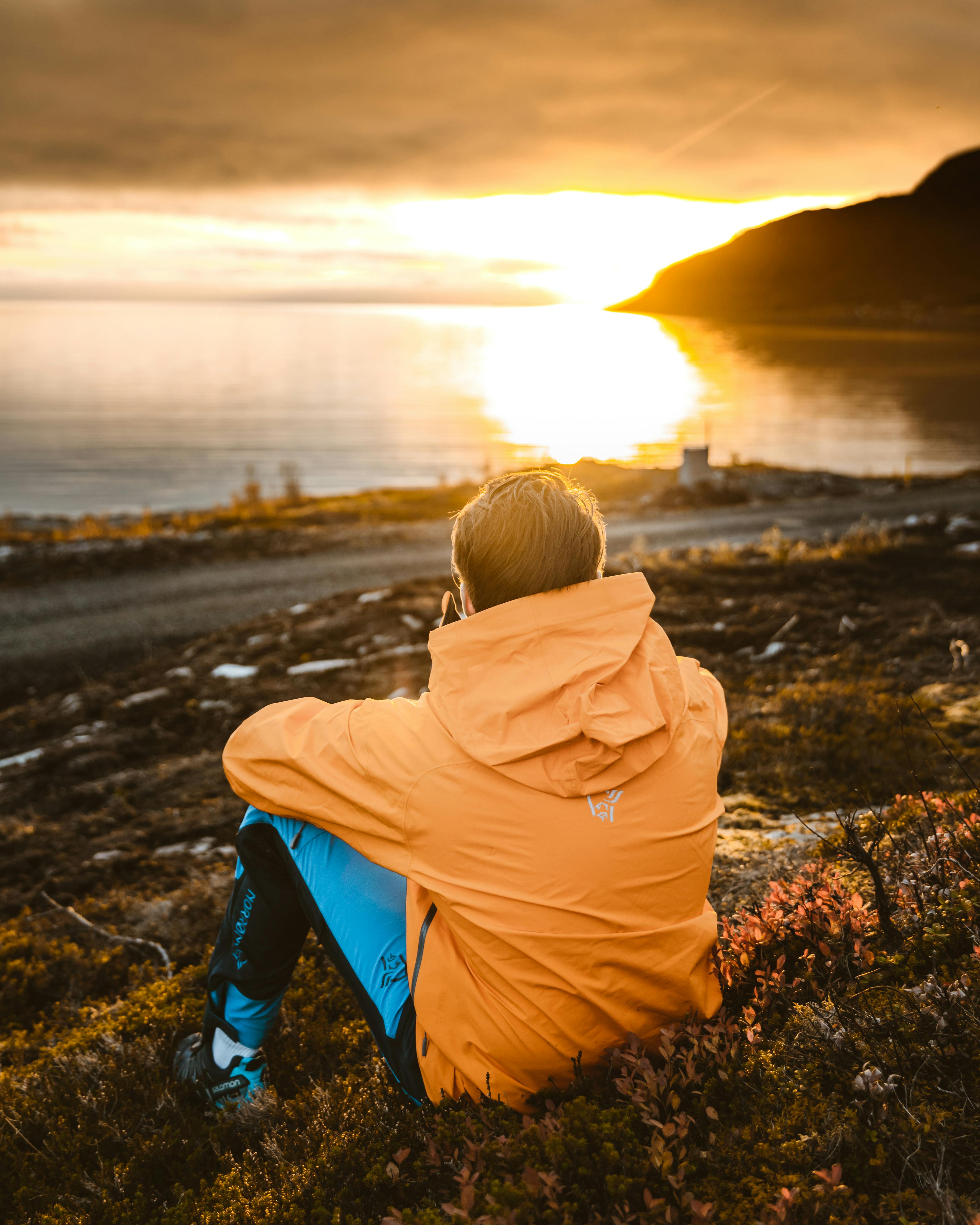 Photo Of Man Sitting On Ground · Free Stock Photo