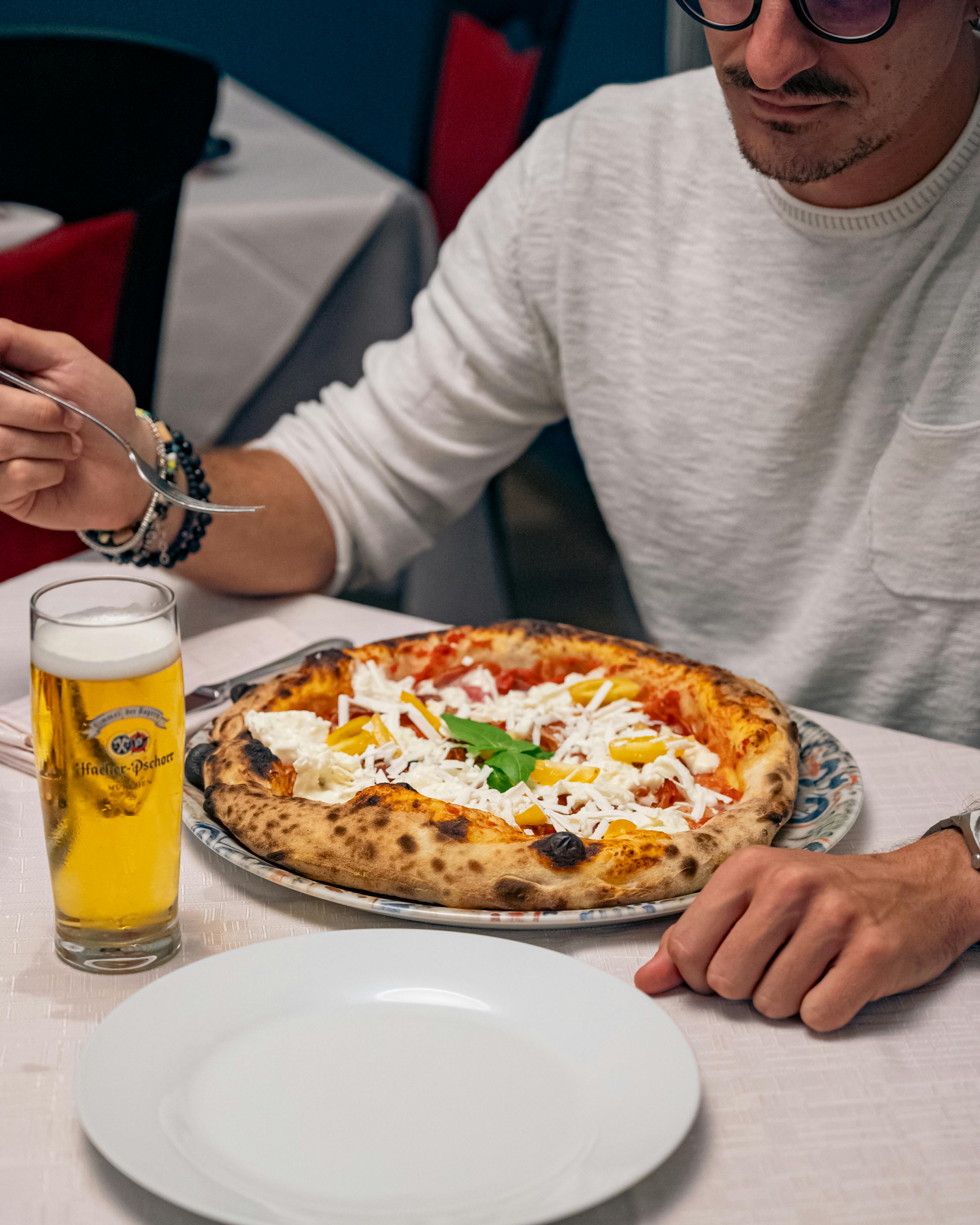 Gourmet Italian Pizza with Beer at Restaurant · Free Stock Photo