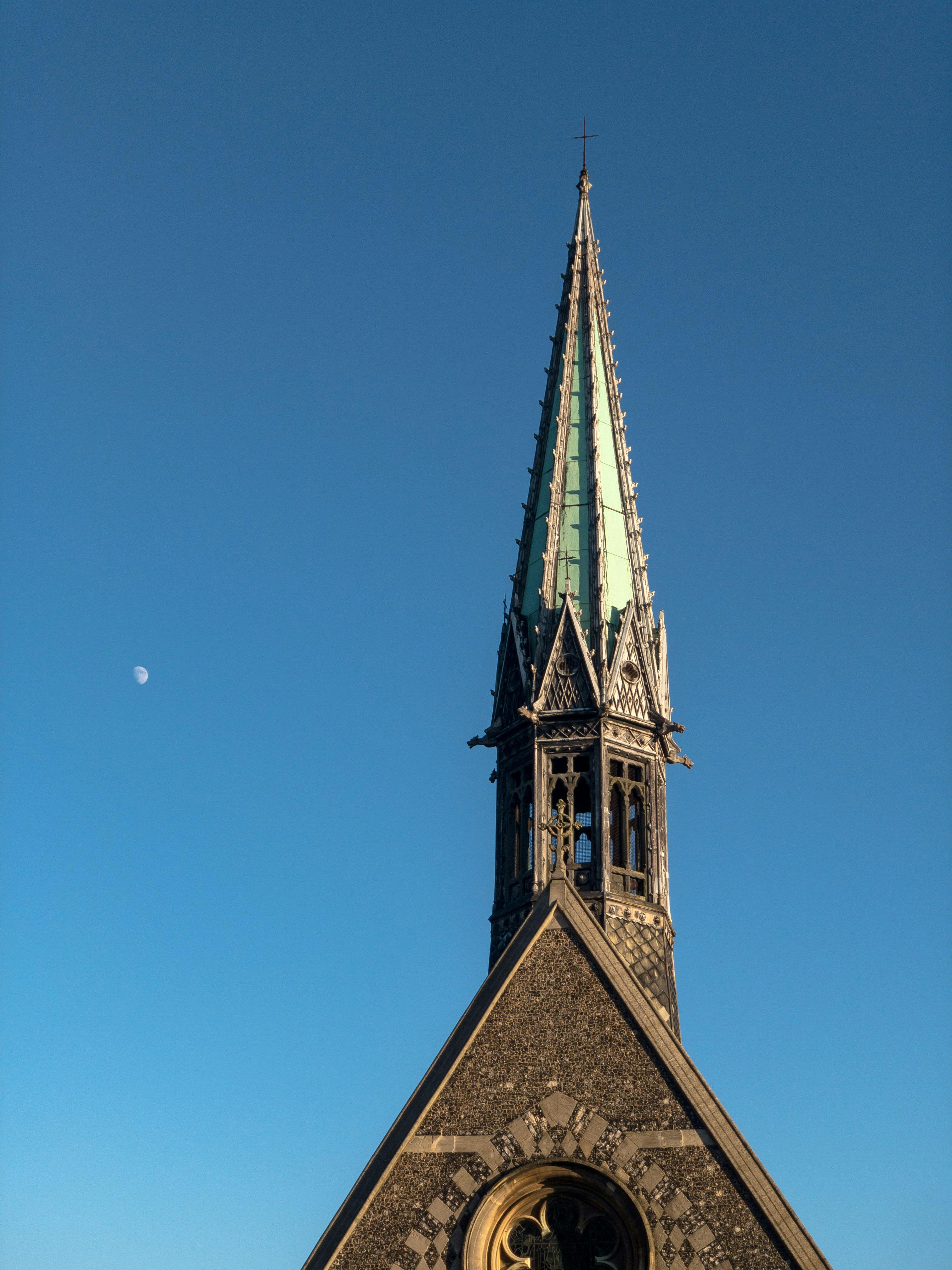 Elegant Gothic Spire Against a Blue Sky · Free Stock Photo