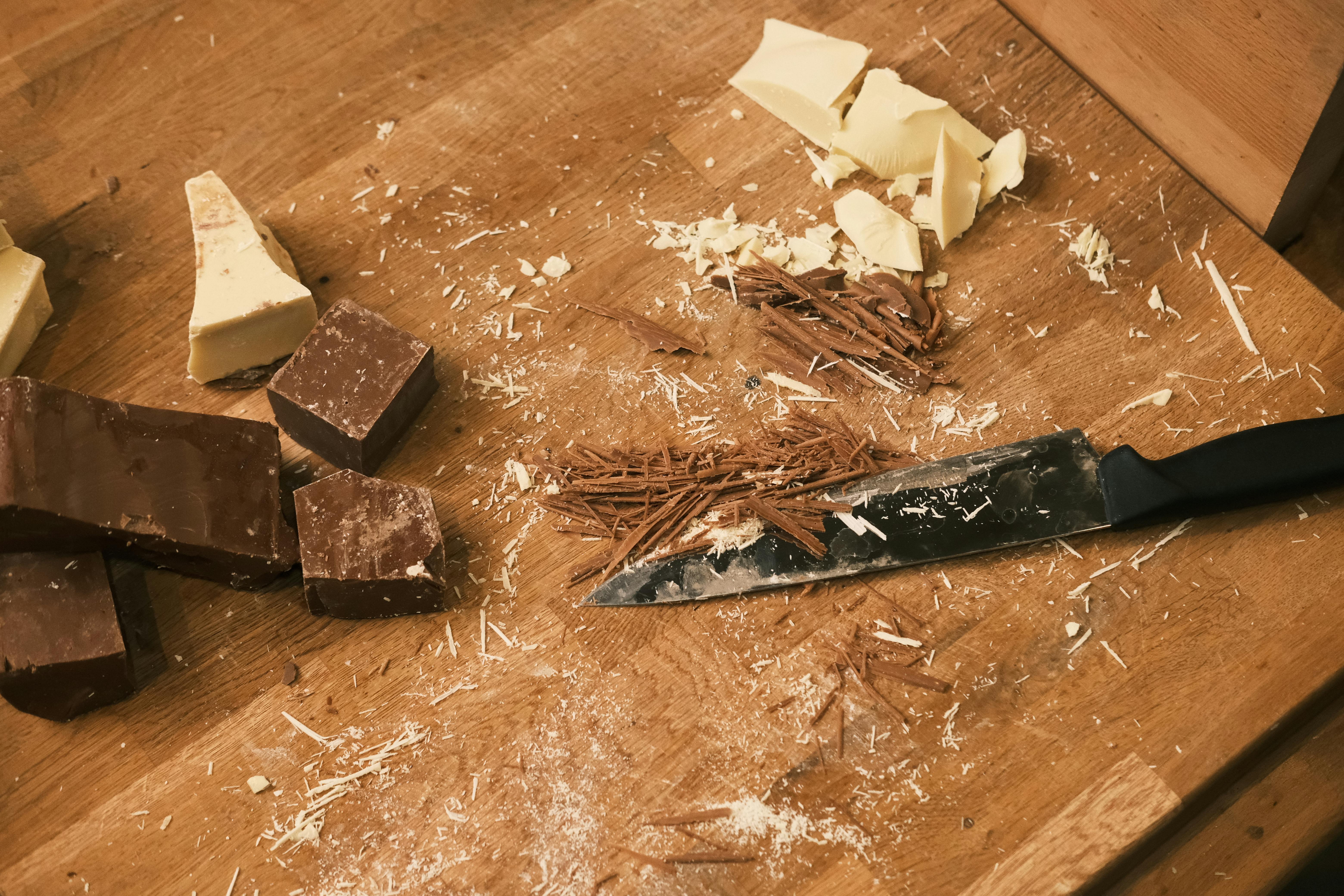 Artisan Chocolate Shaving on Wooden Table · Free Stock Photo
