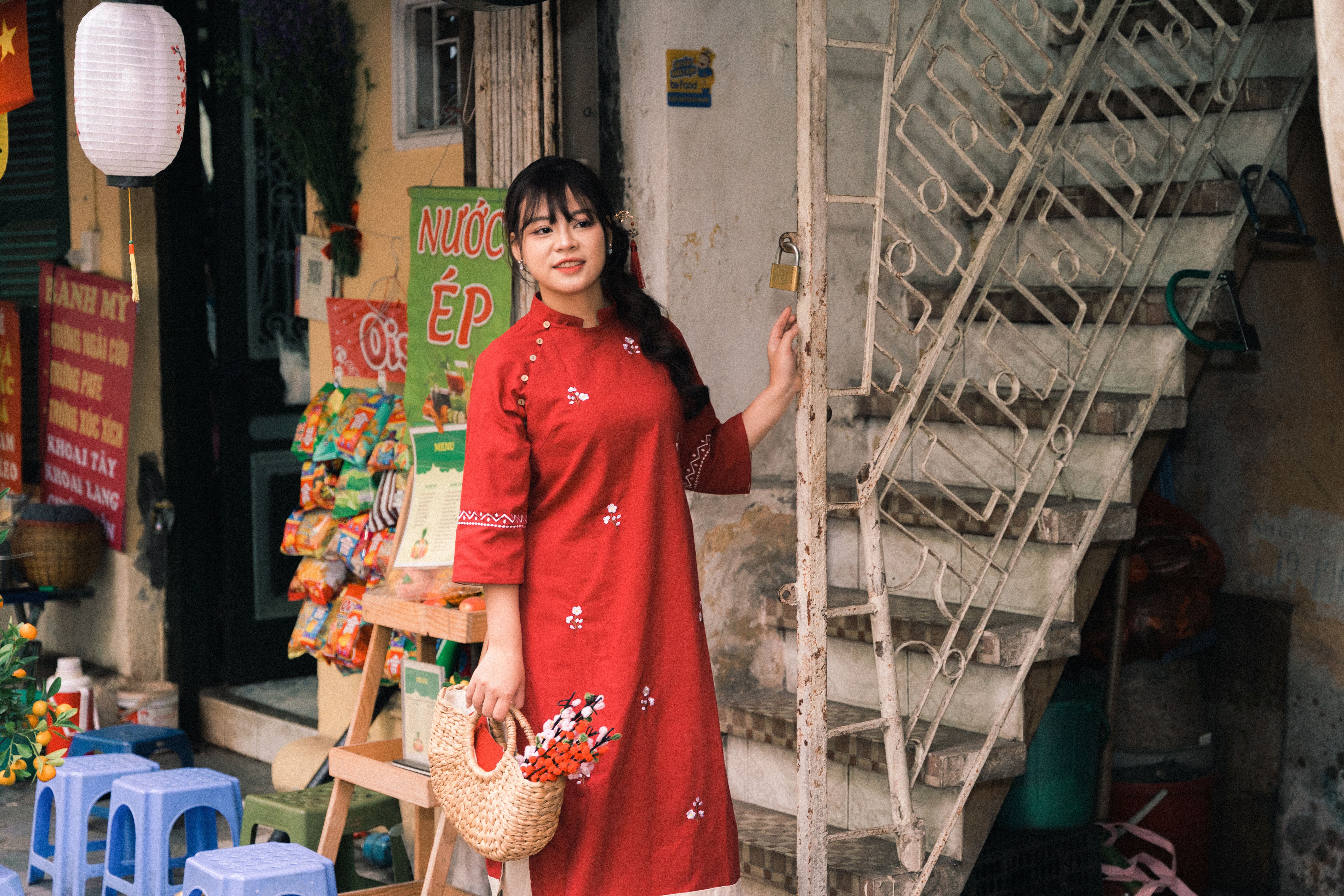 Young Woman in Traditional Dress in Hanoi Street Scene · Free Stock Photo