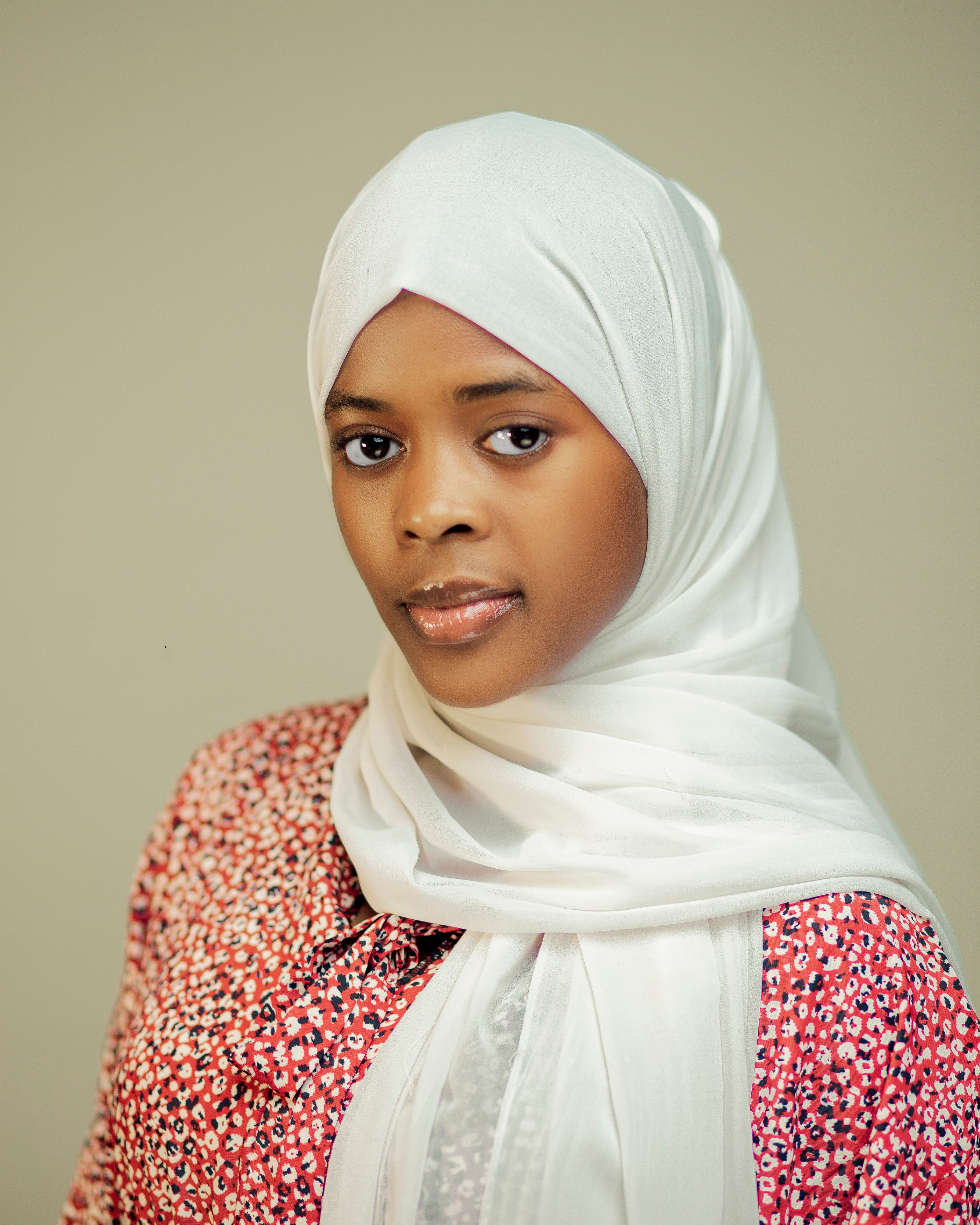 Portrait of a Woman in Traditional Headscarf · Free Stock Photo