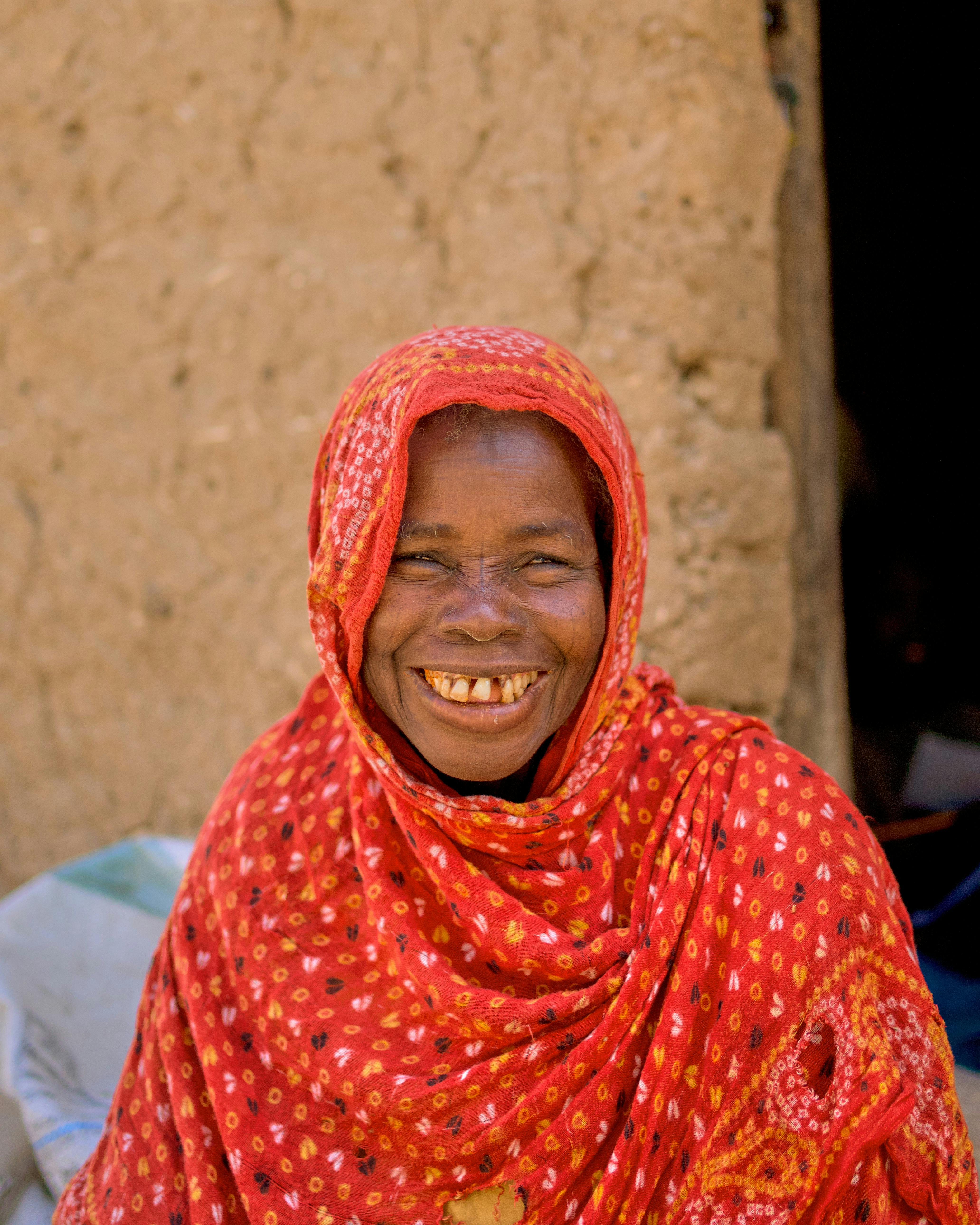Smiling Woman in Traditional Nigerian Attire · Free Stock Photo