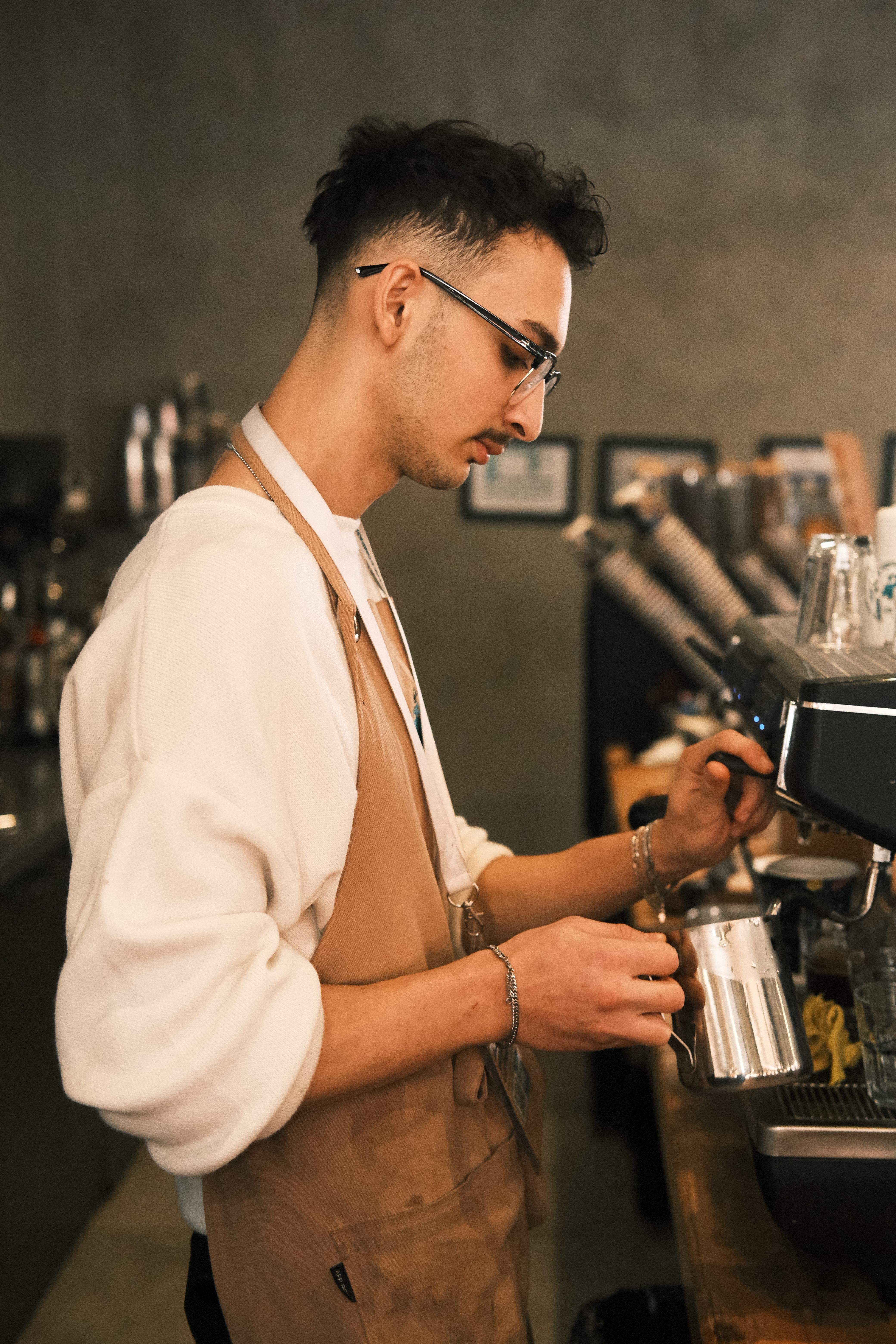 Skilled Barista Preparing Coffee in Cozy Café · Free Stock Photo