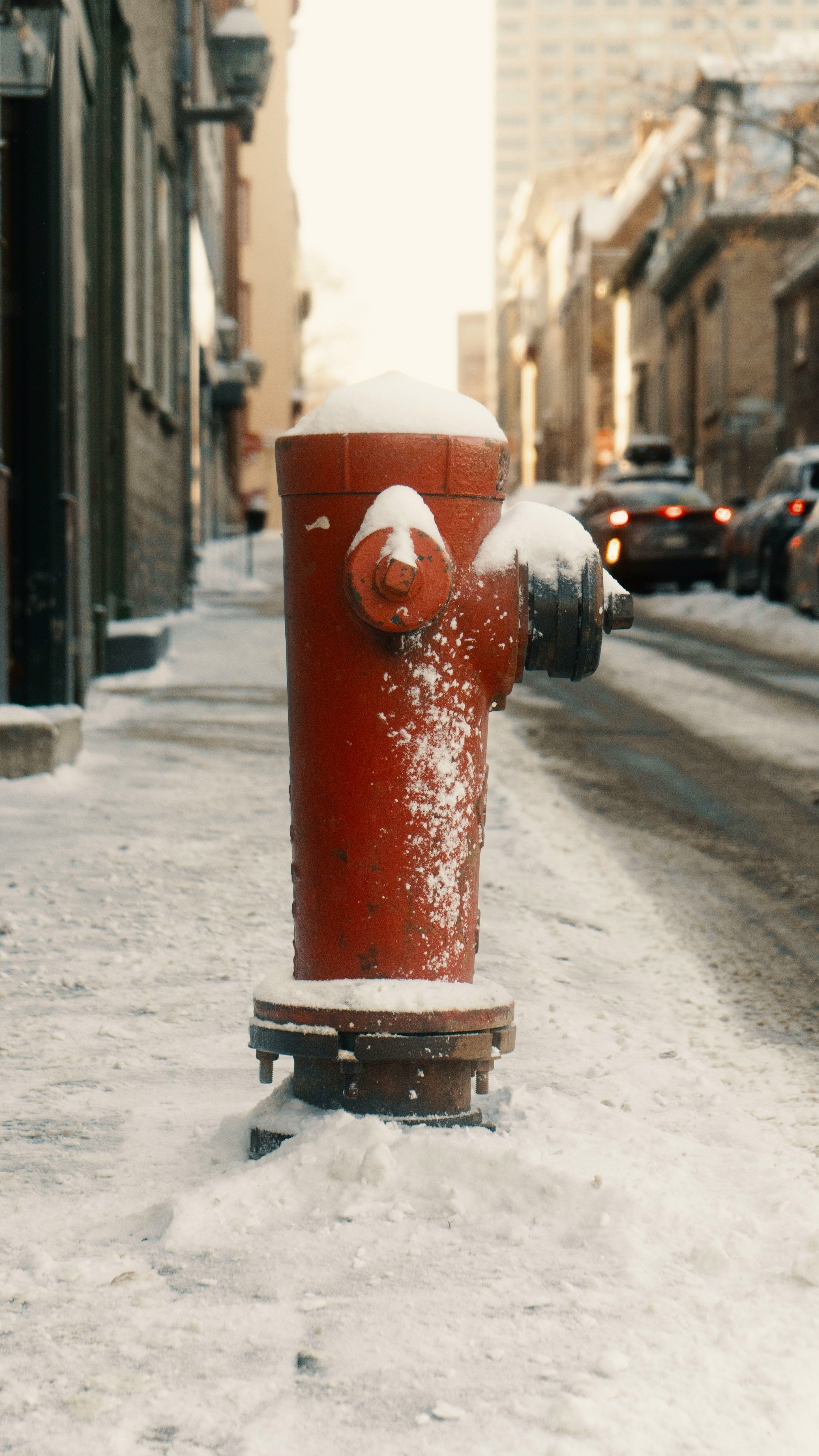 Red Fire Hydrant on Snowy Urban Street · Free Stock Photo