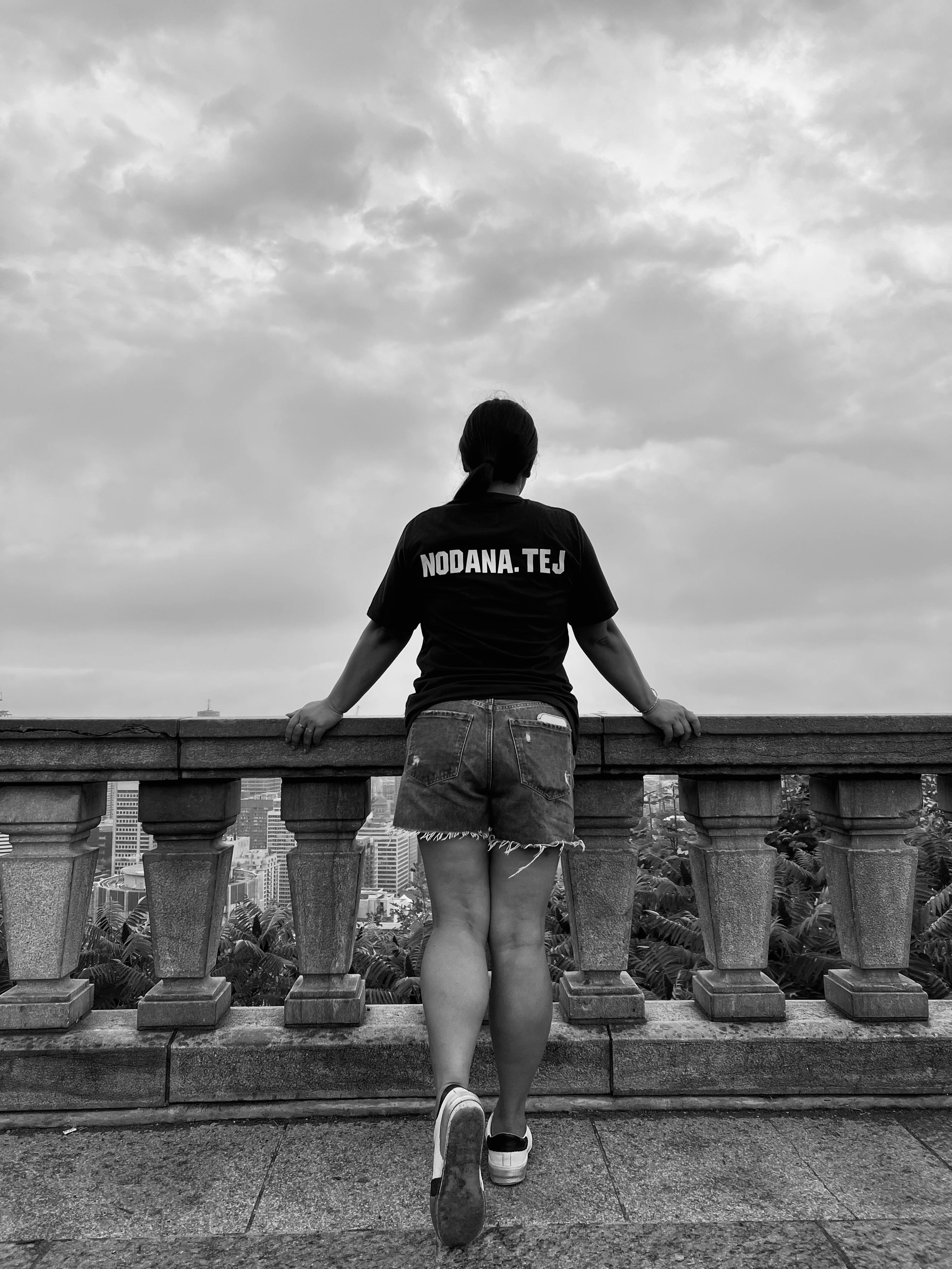 Contemplative Woman Overlooking Urban Landscape · Free Stock Photo