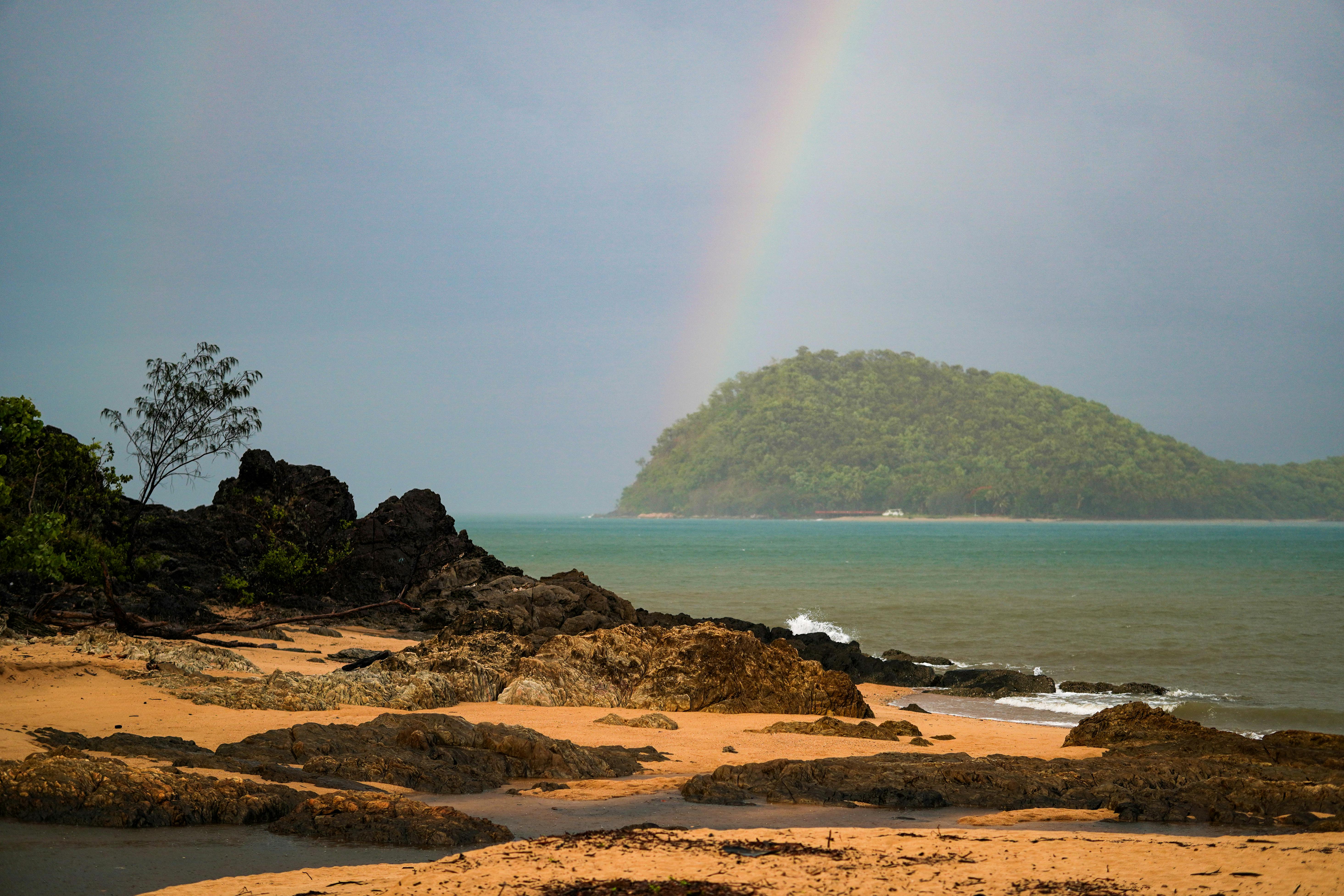 Scenic Beach with Rainbow and Island View · Free Stock Photo