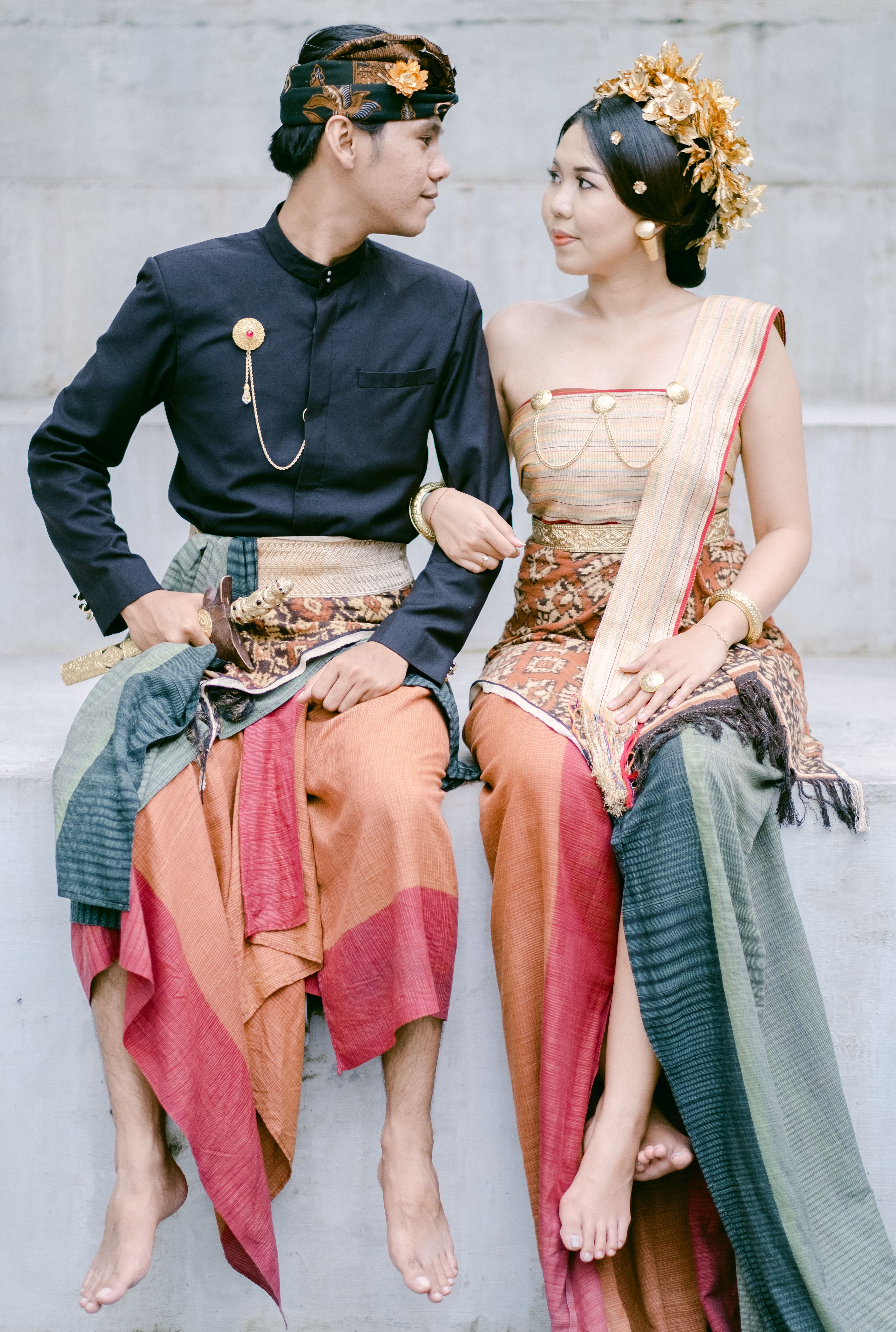 Couple in Traditional Southeast Asian Attire · Free Stock Photo