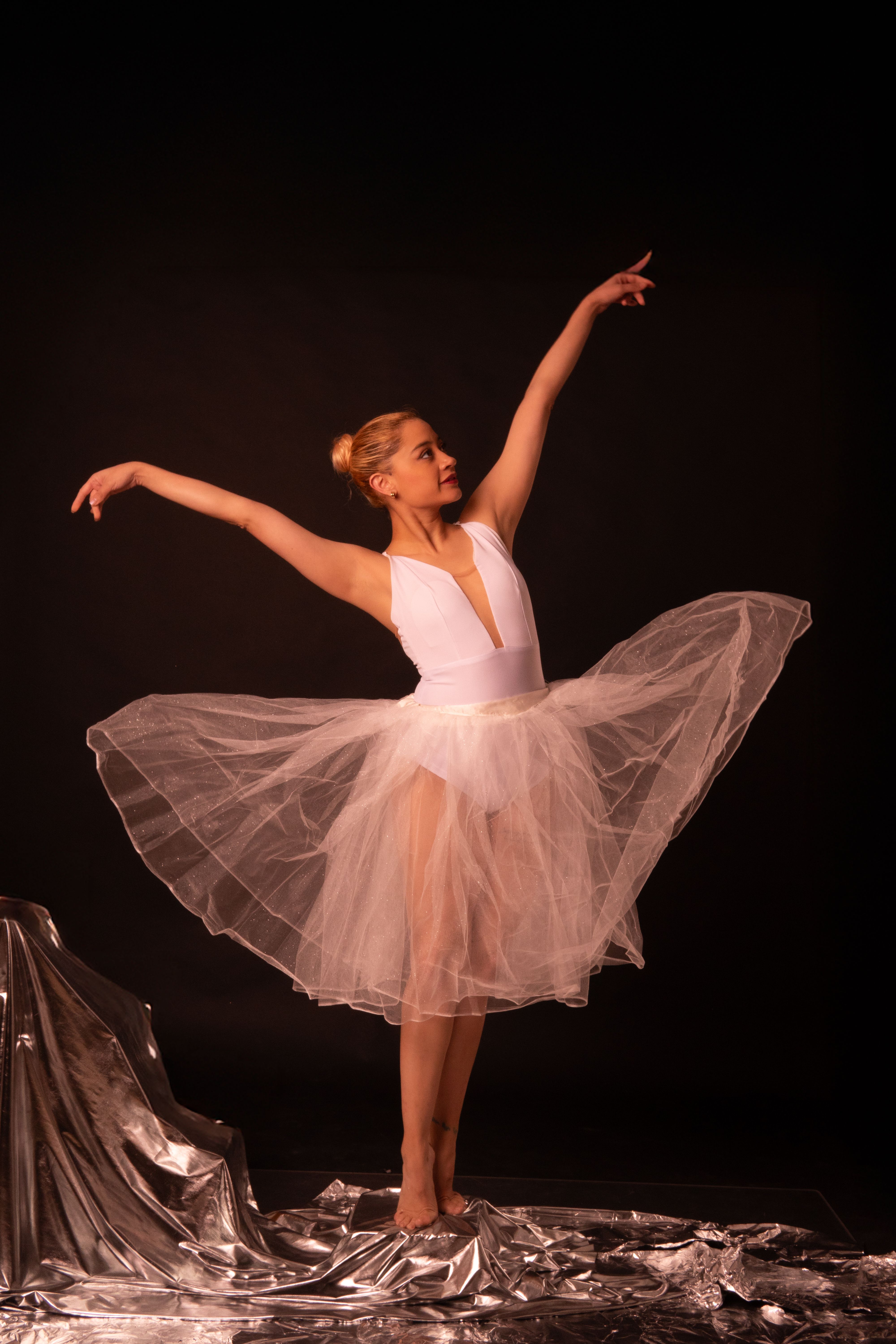Elegant Ballerina Posing in White Dress · Free Stock Photo
