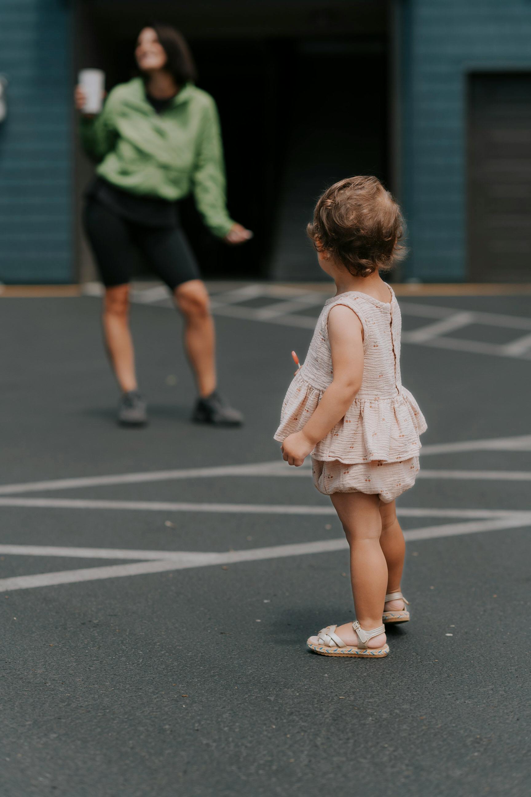 Young Child Observing Adult in Urban Setting · Free Stock Photo