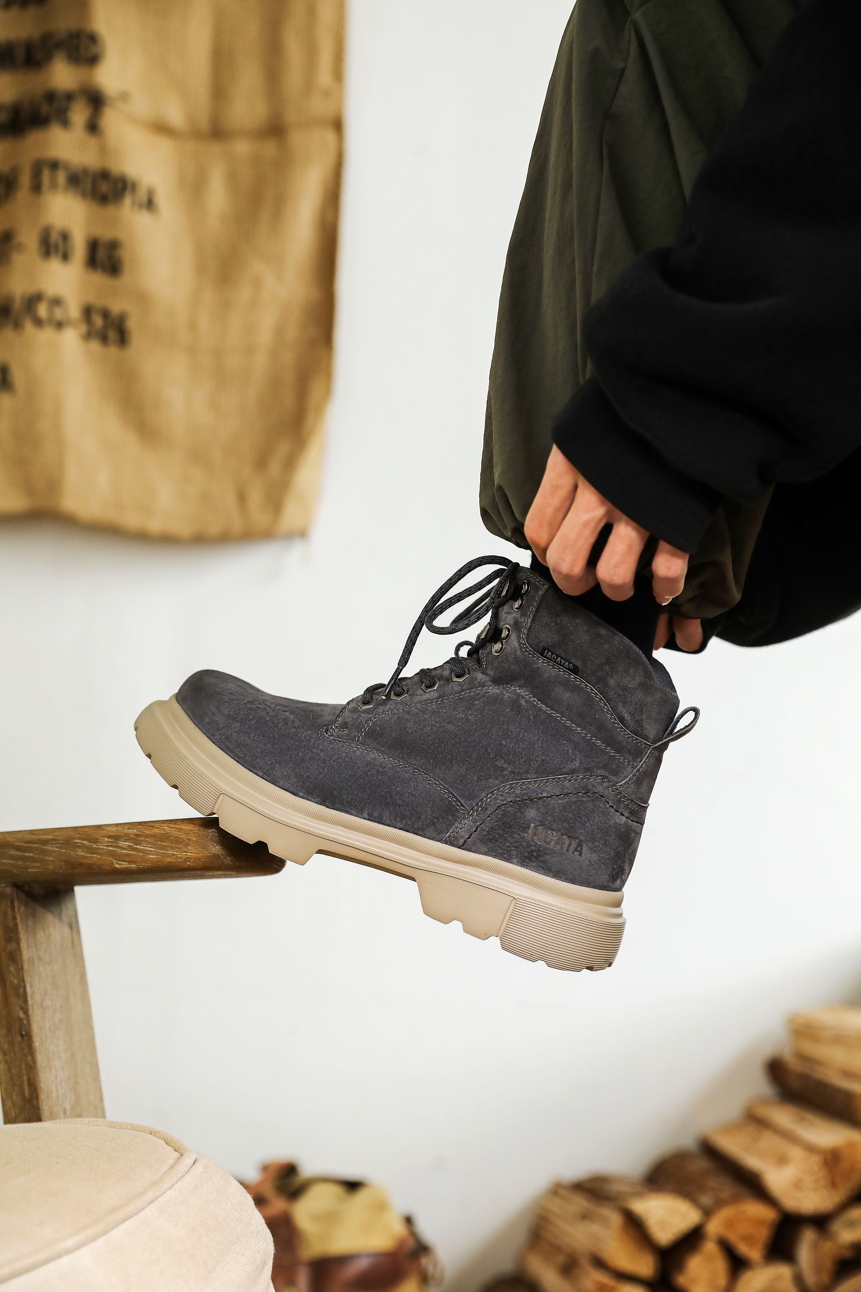 Casual Suede Boot on Wooden Stool · Free Stock Photo