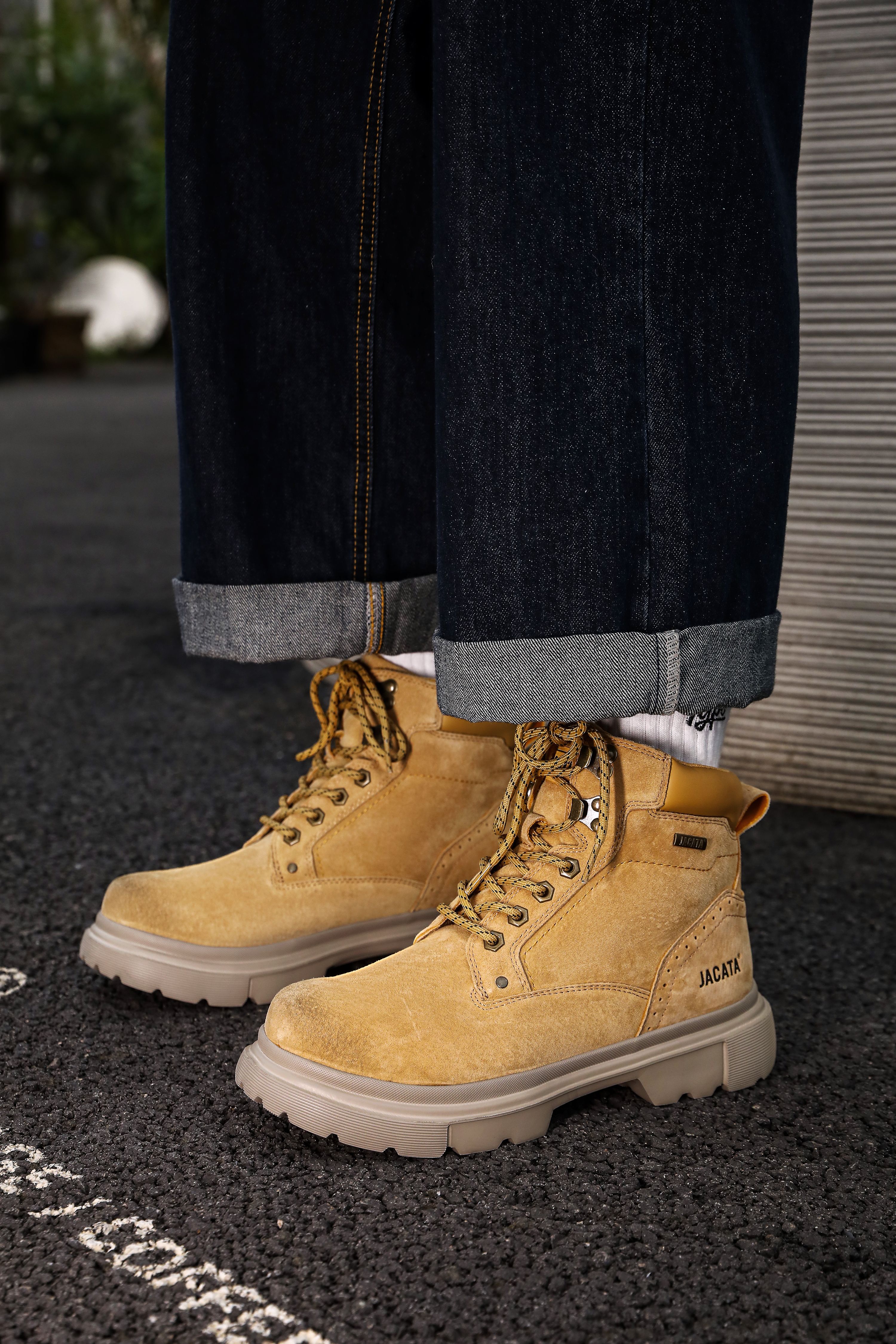 Stylish Tan Suede Boots on Urban Pavement · Free Stock Photo