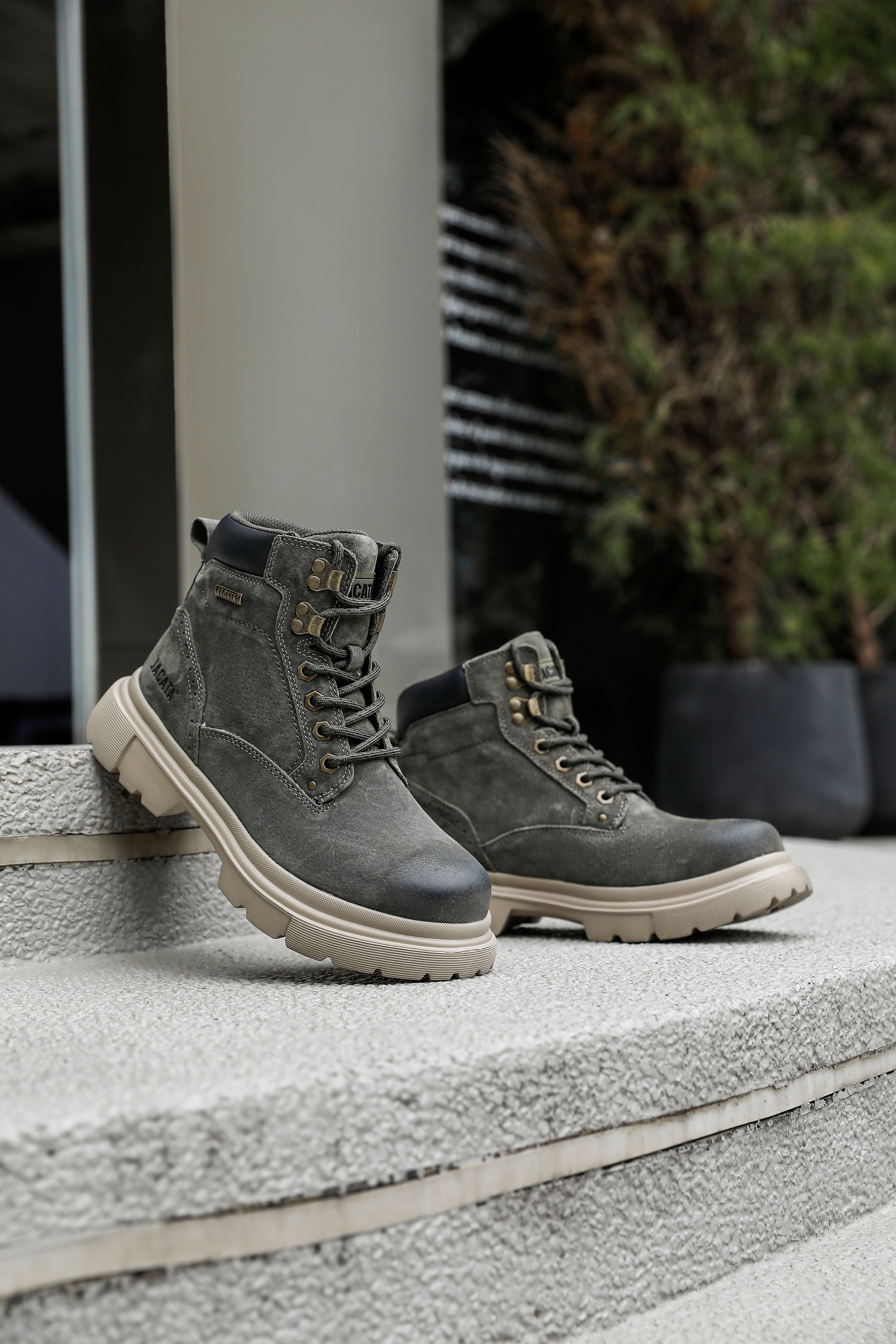 Stylish Outdoor Hiking Boots on Concrete Steps · Free Stock Photo