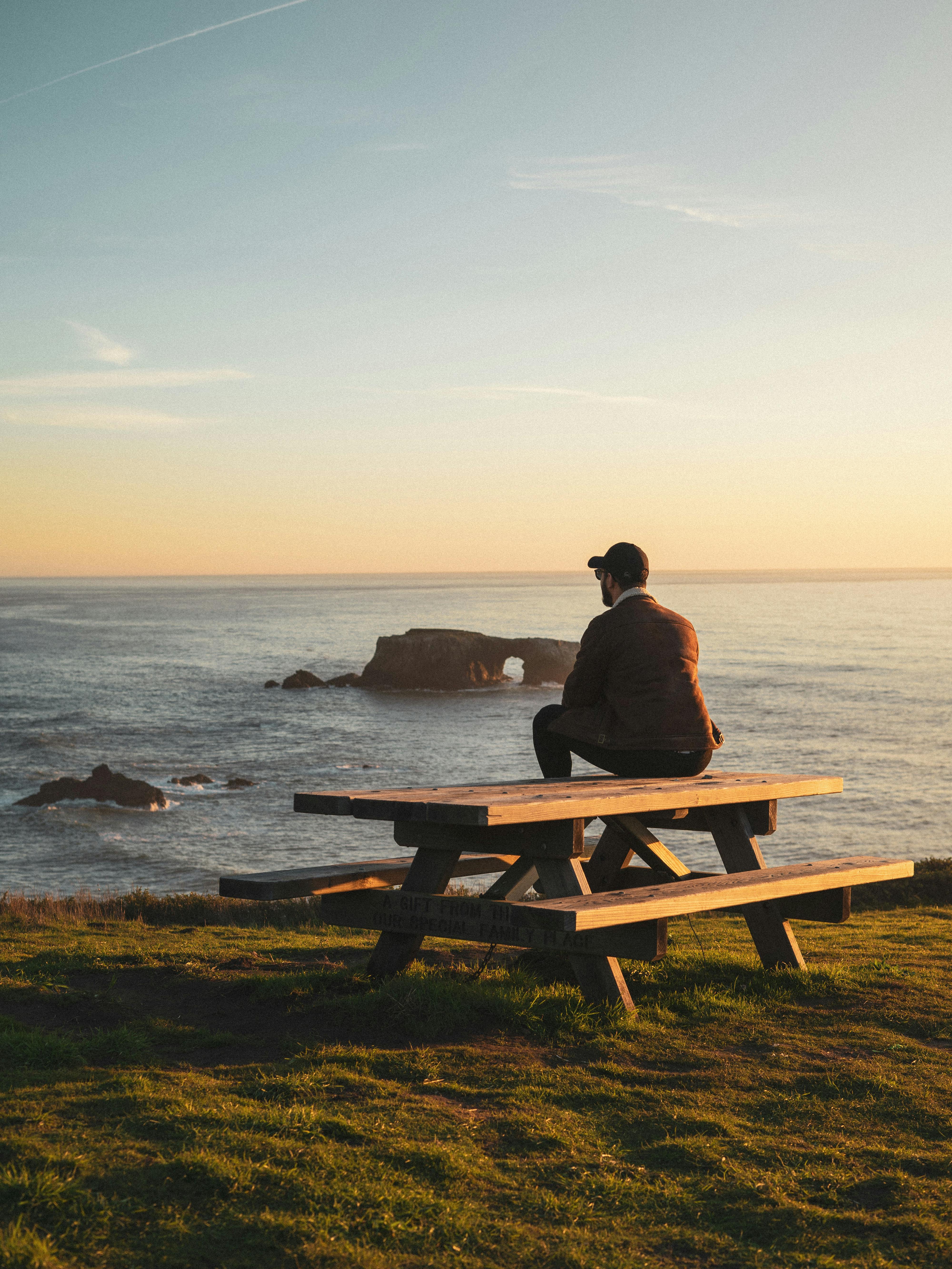 Contemplative Man at Sunset on California Beach · Free Stock Photo