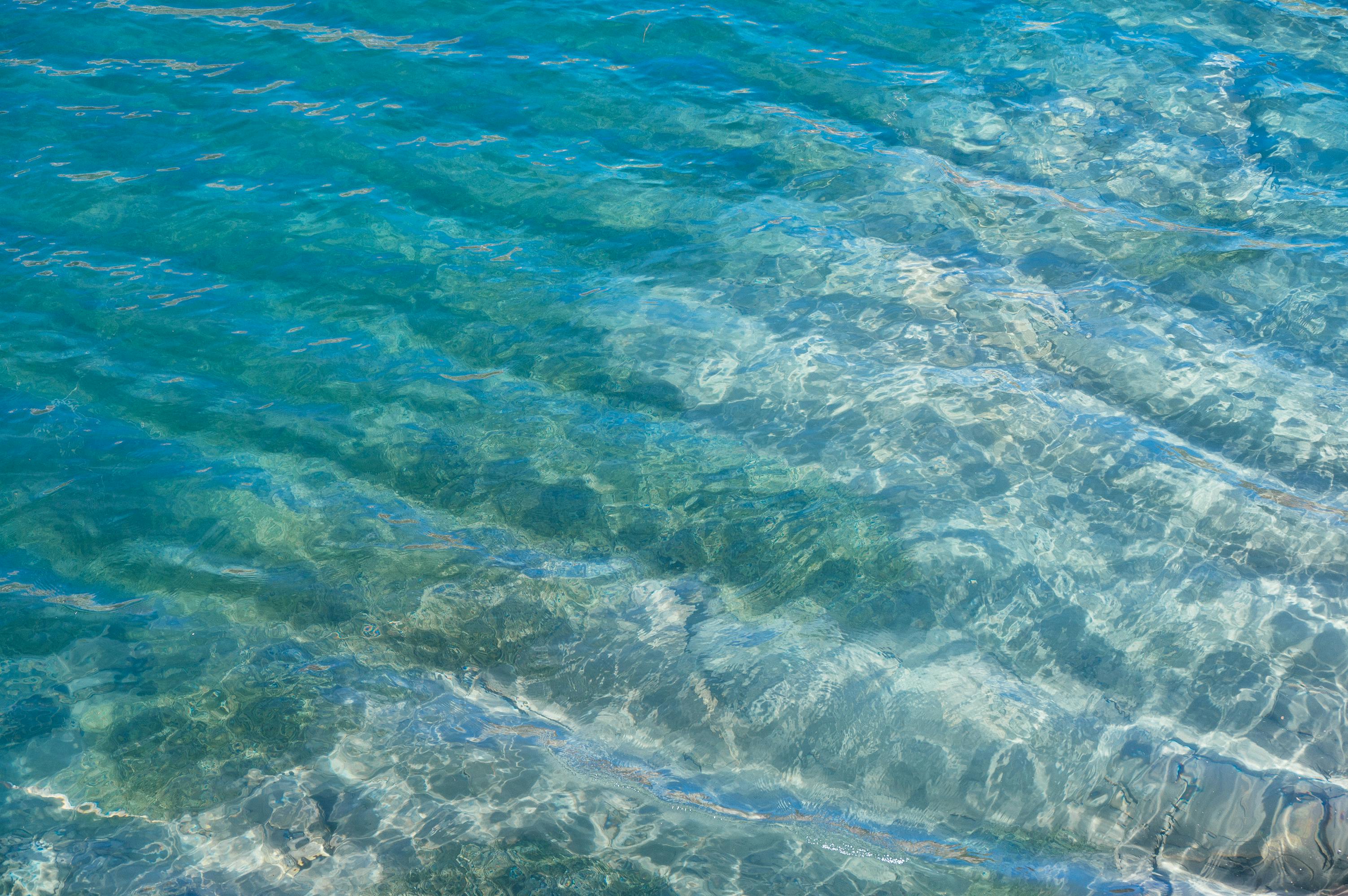 Crystal Clear Blue Water with Sunlit Ripples · Free Stock Photo