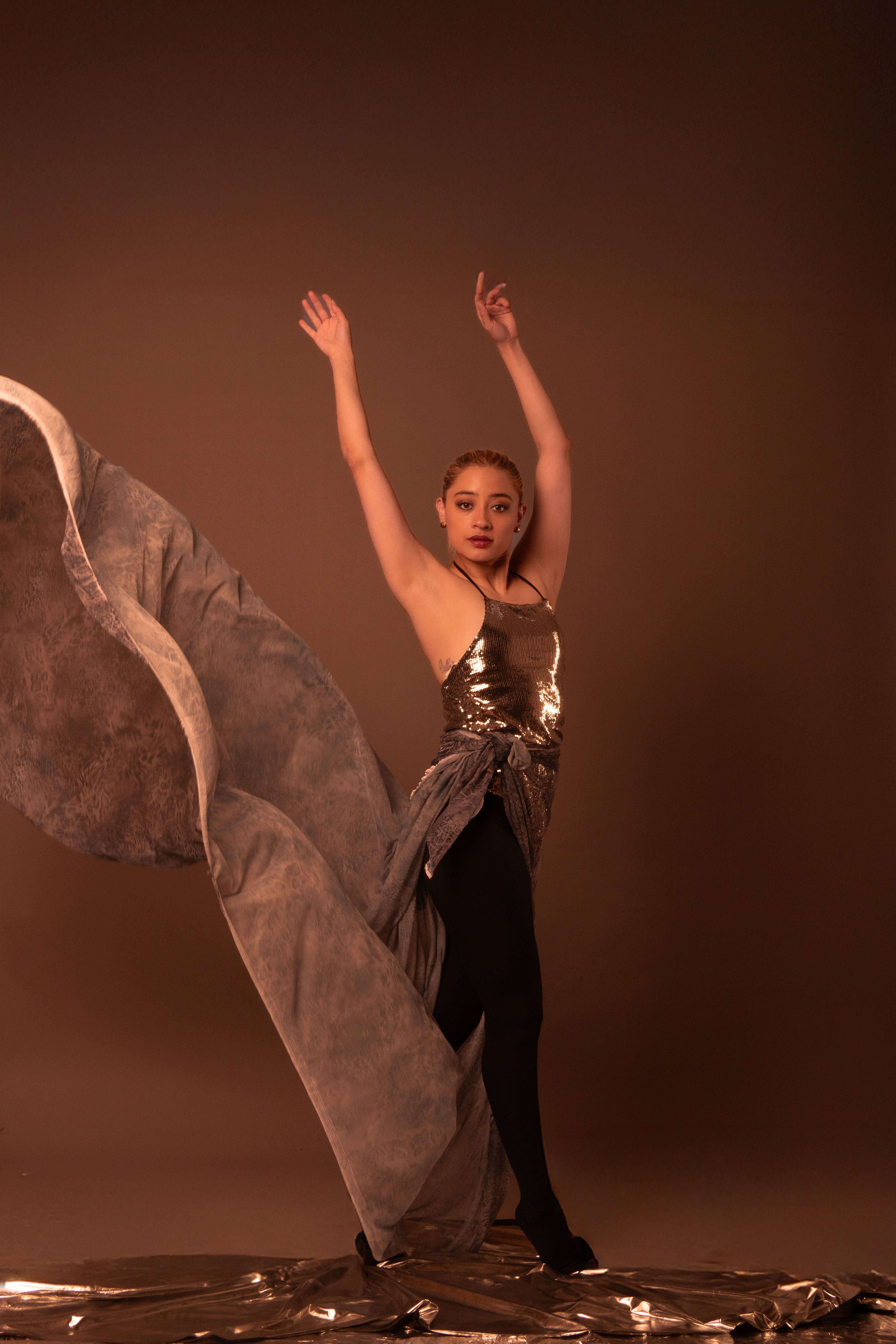 Graceful Ballerina in Metallic Costume Dancing · Free Stock Photo