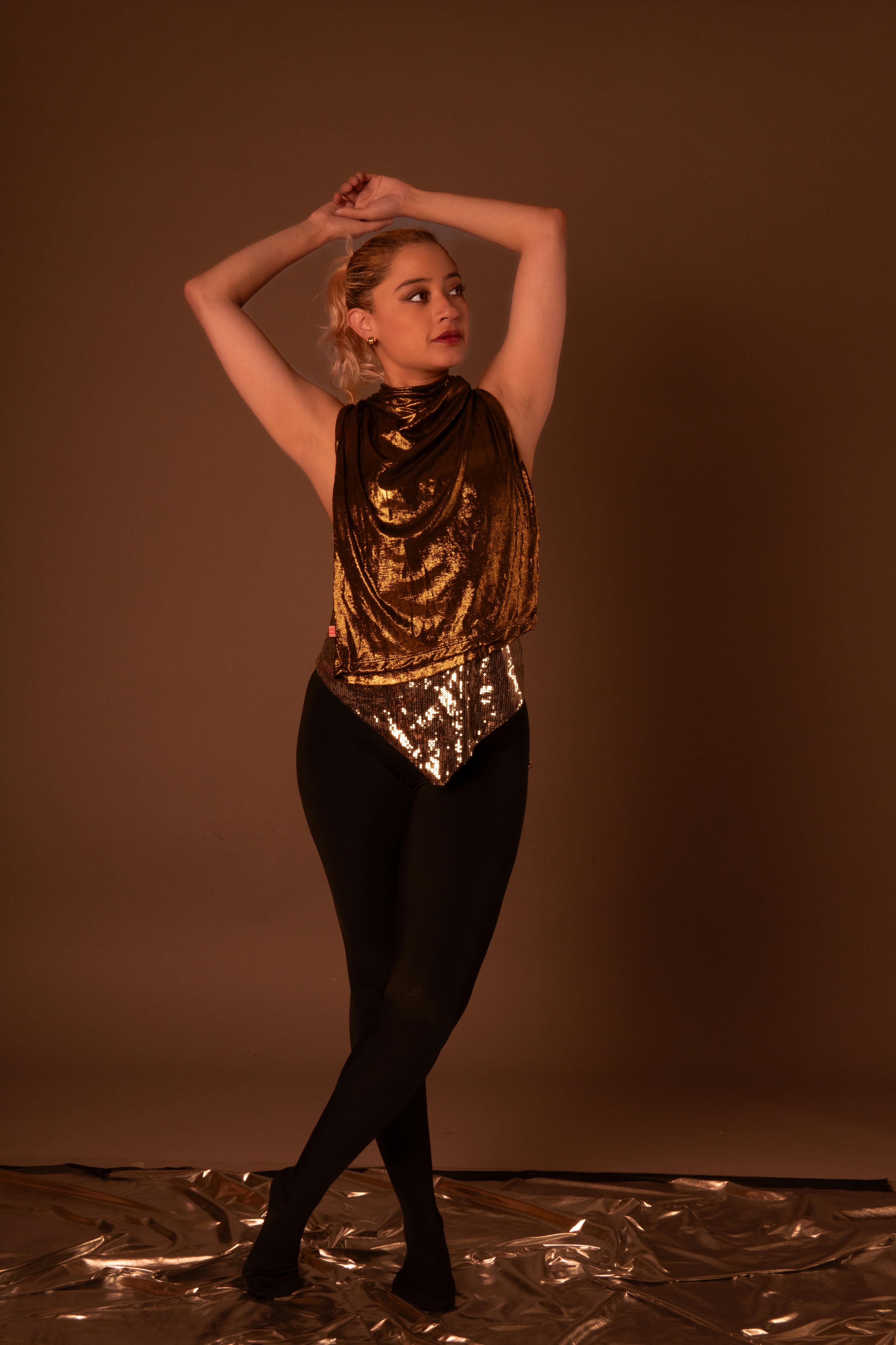 Elegant Contemporary Dancer in Golden Attire · Free Stock Photo