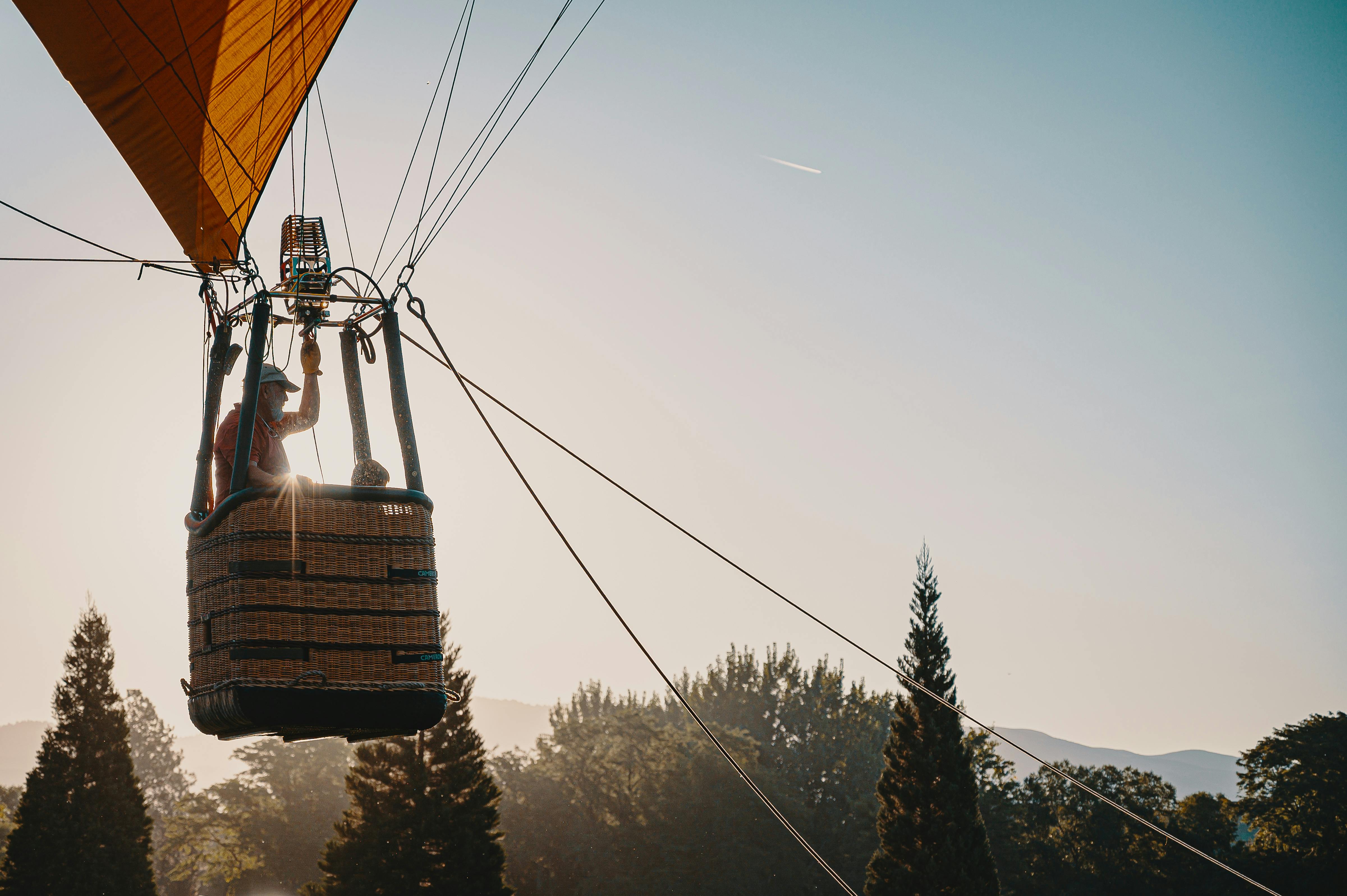 Man Riding in Hot Air Balloon · Free Stock Photo