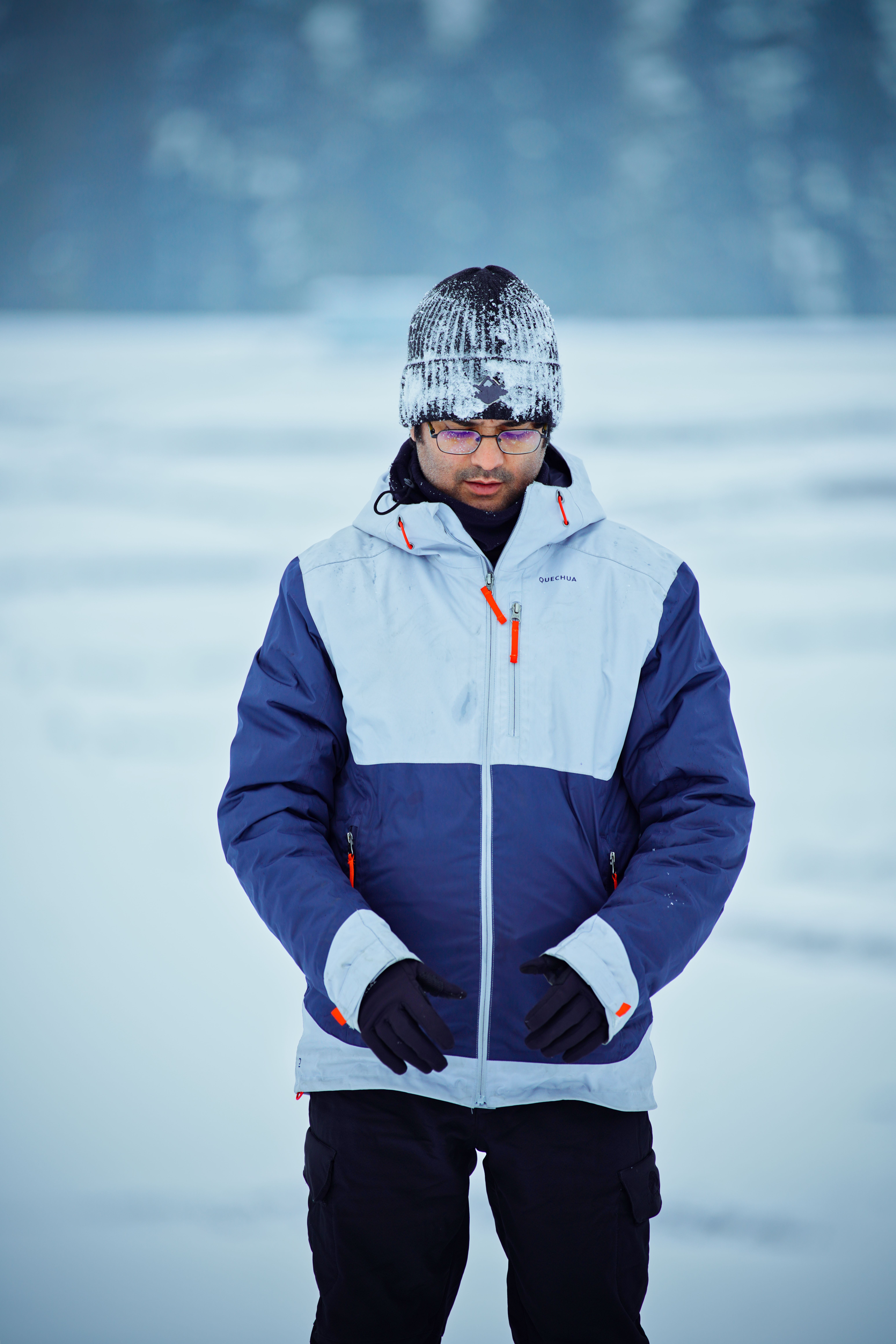 Man in Winter Jacket Standing in Snowy Landscape · Free Stock Photo