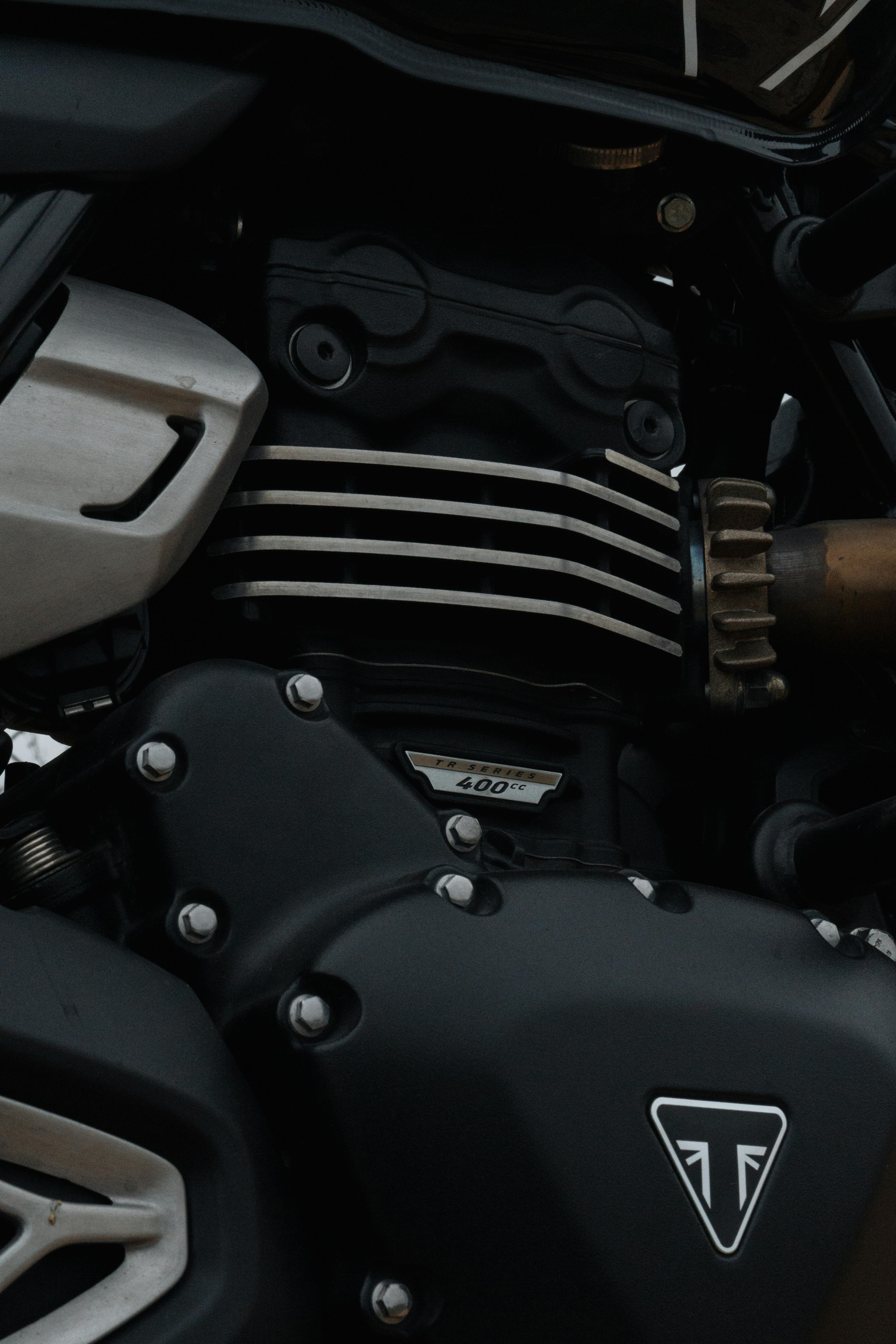 Close-Up of Black Motorcycle Engine with Chrome · Free Stock Photo