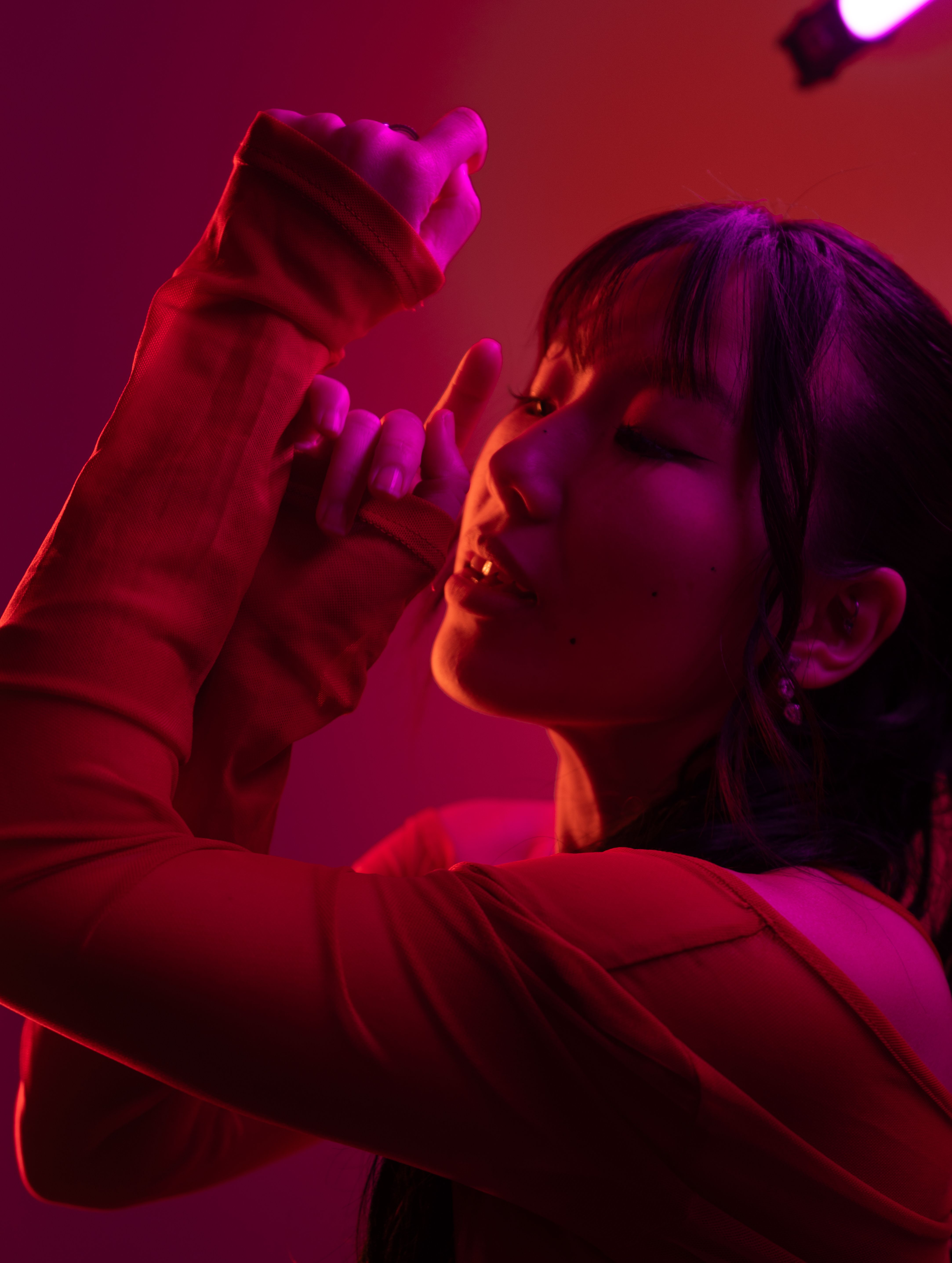 Vibrant Portrait of Woman in Red Lighting · Free Stock Photo