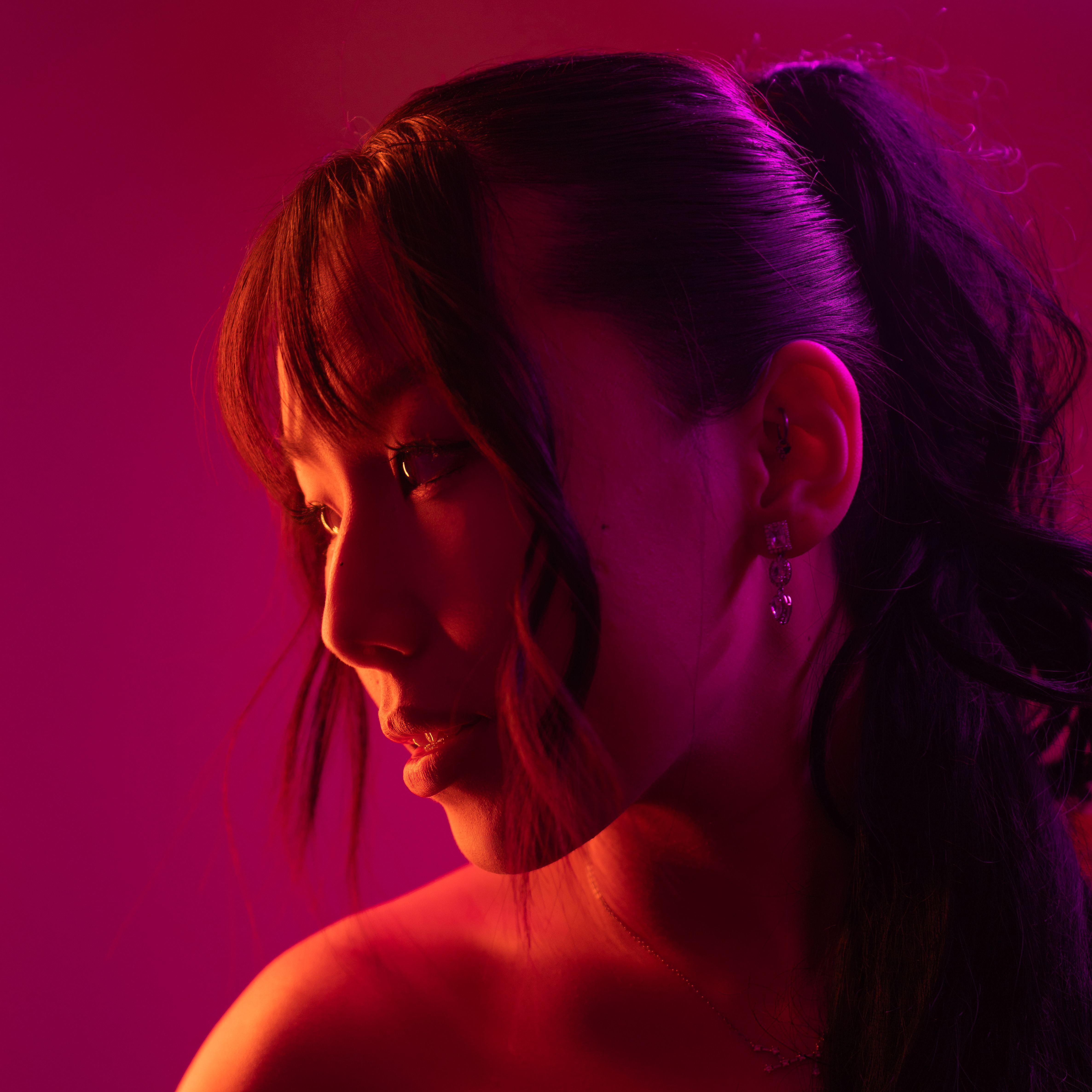 Artistic Portrait in Vibrant Red Lighting · Free Stock Photo