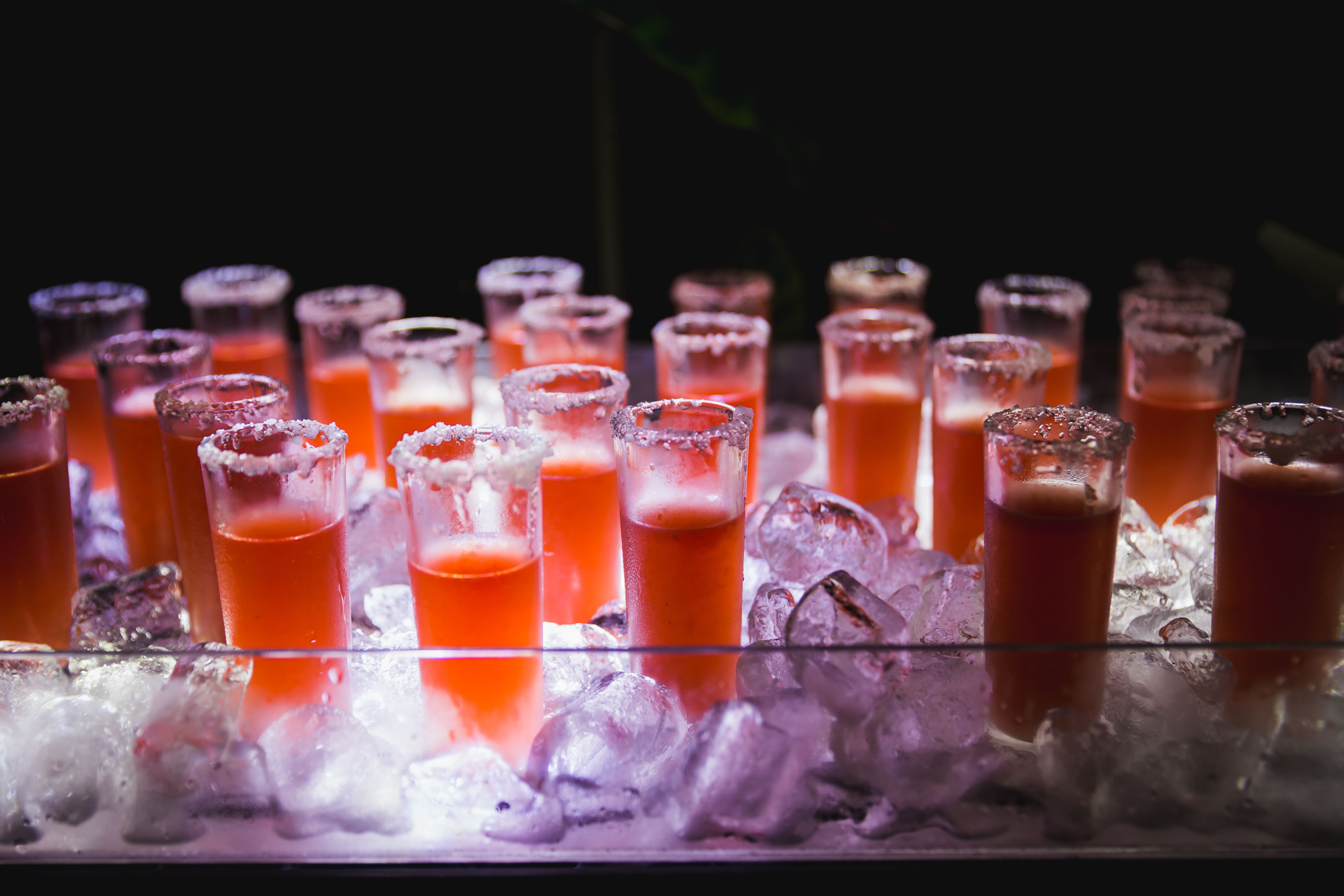 Colorful Red Cocktails on Ice Display · Free Stock Photo