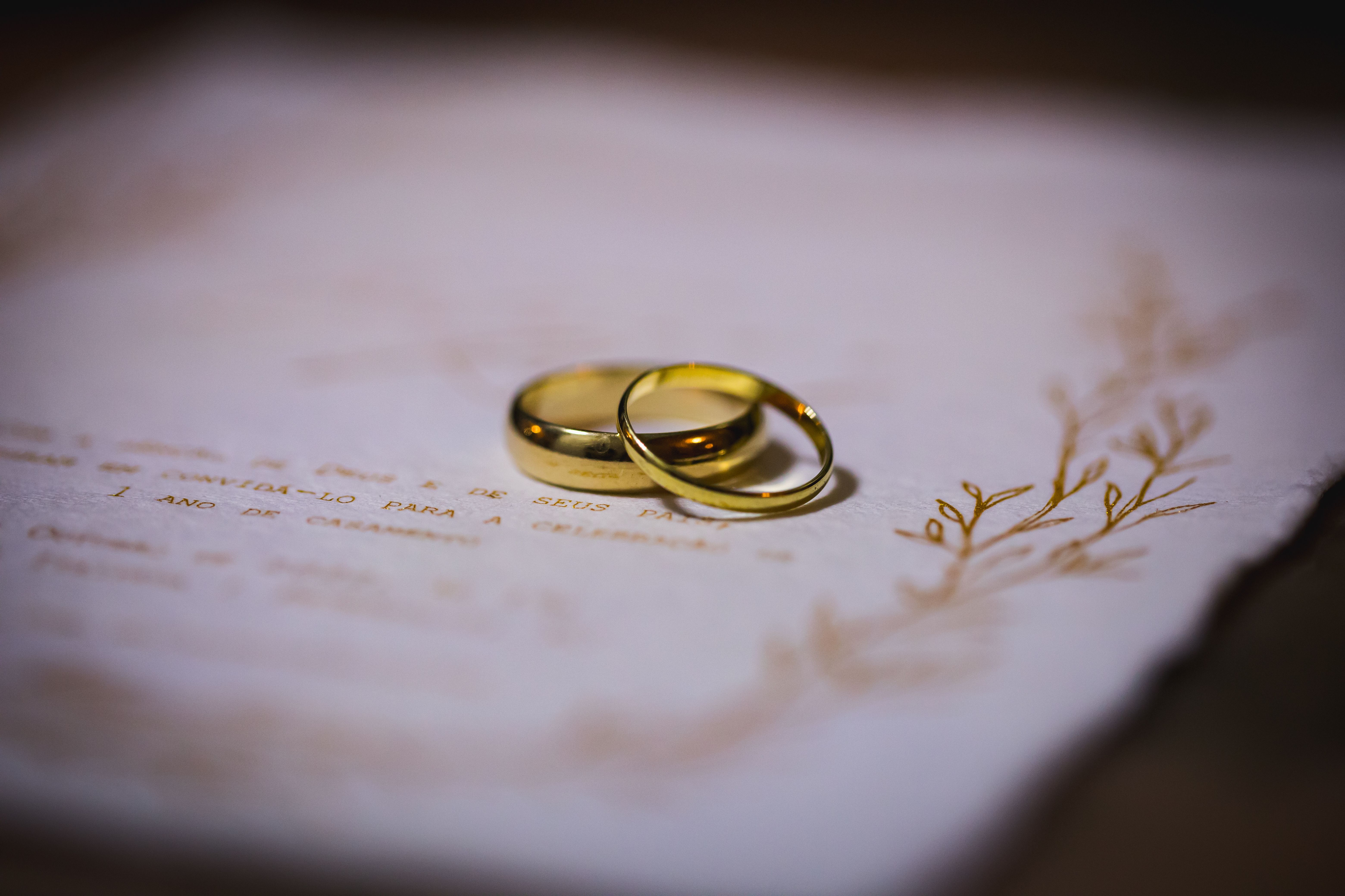 Elegant Gold Wedding Rings on Invitation · Free Stock Photo