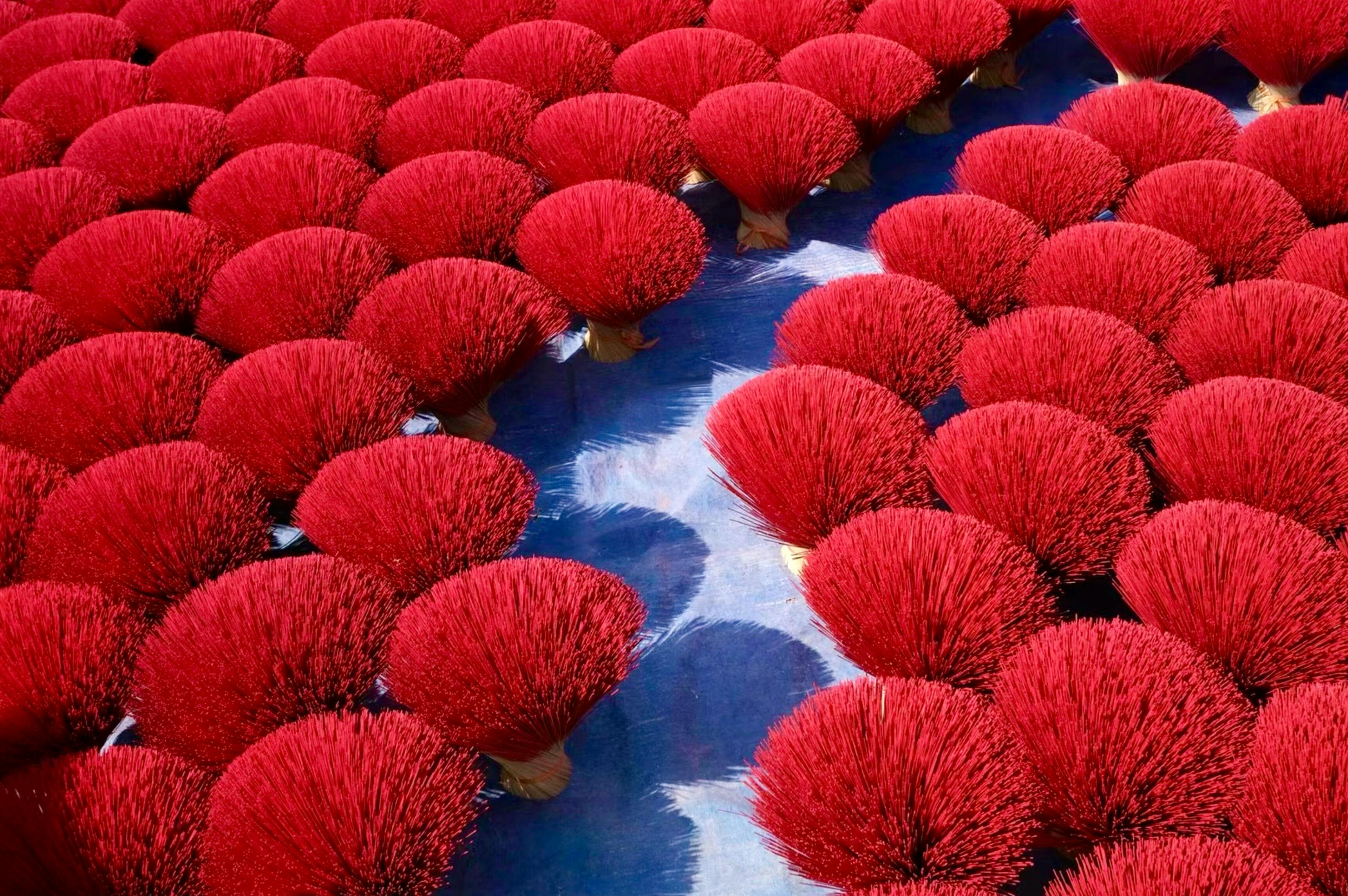 Red Incense Sticks Drying in Sunlight · Free Stock Photo