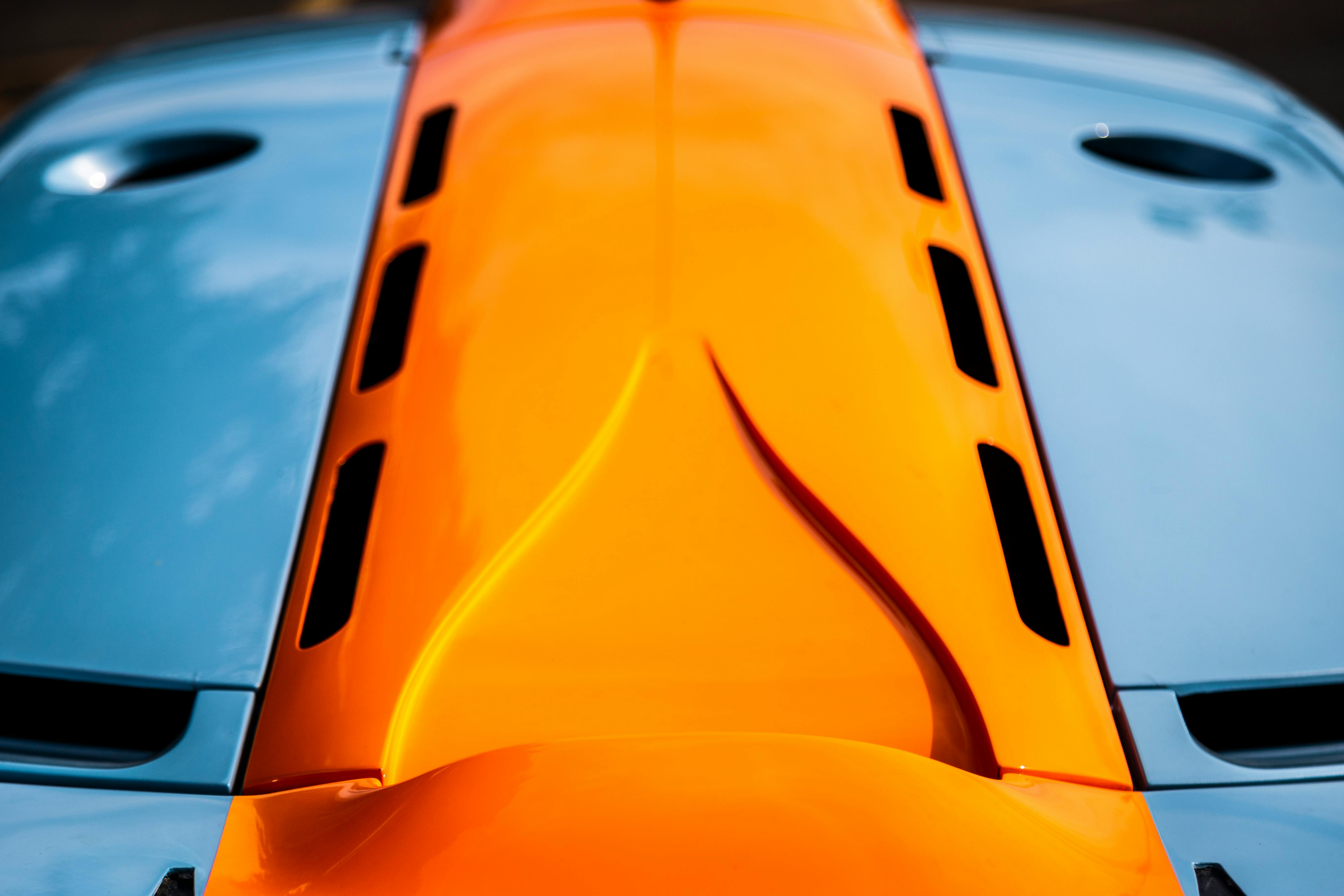 Close-up of Vibrant Sports Car Hood Design · Free Stock Photo