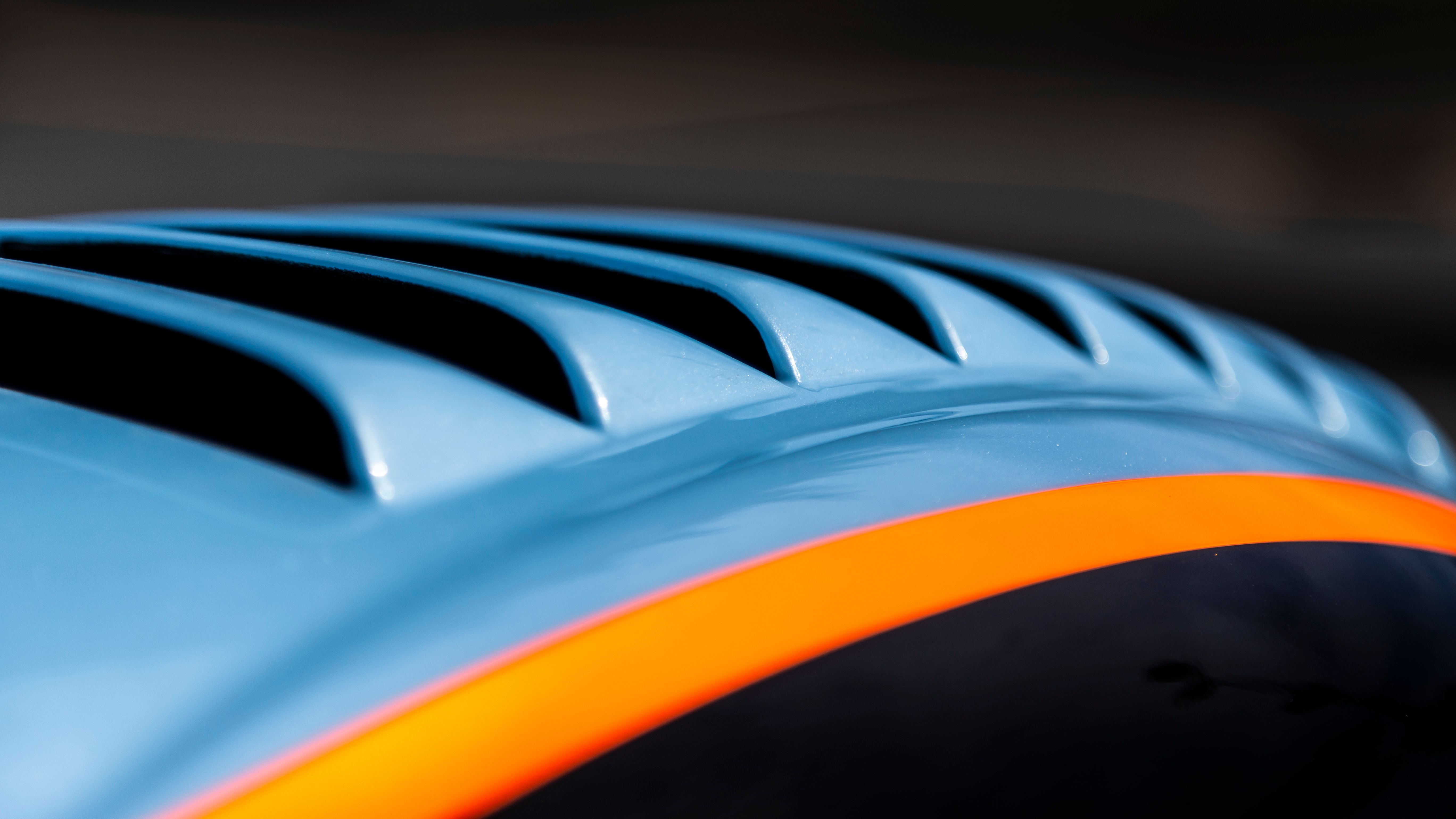 Close-up of Blue Sports Car with Orange Stripe · Free Stock Photo
