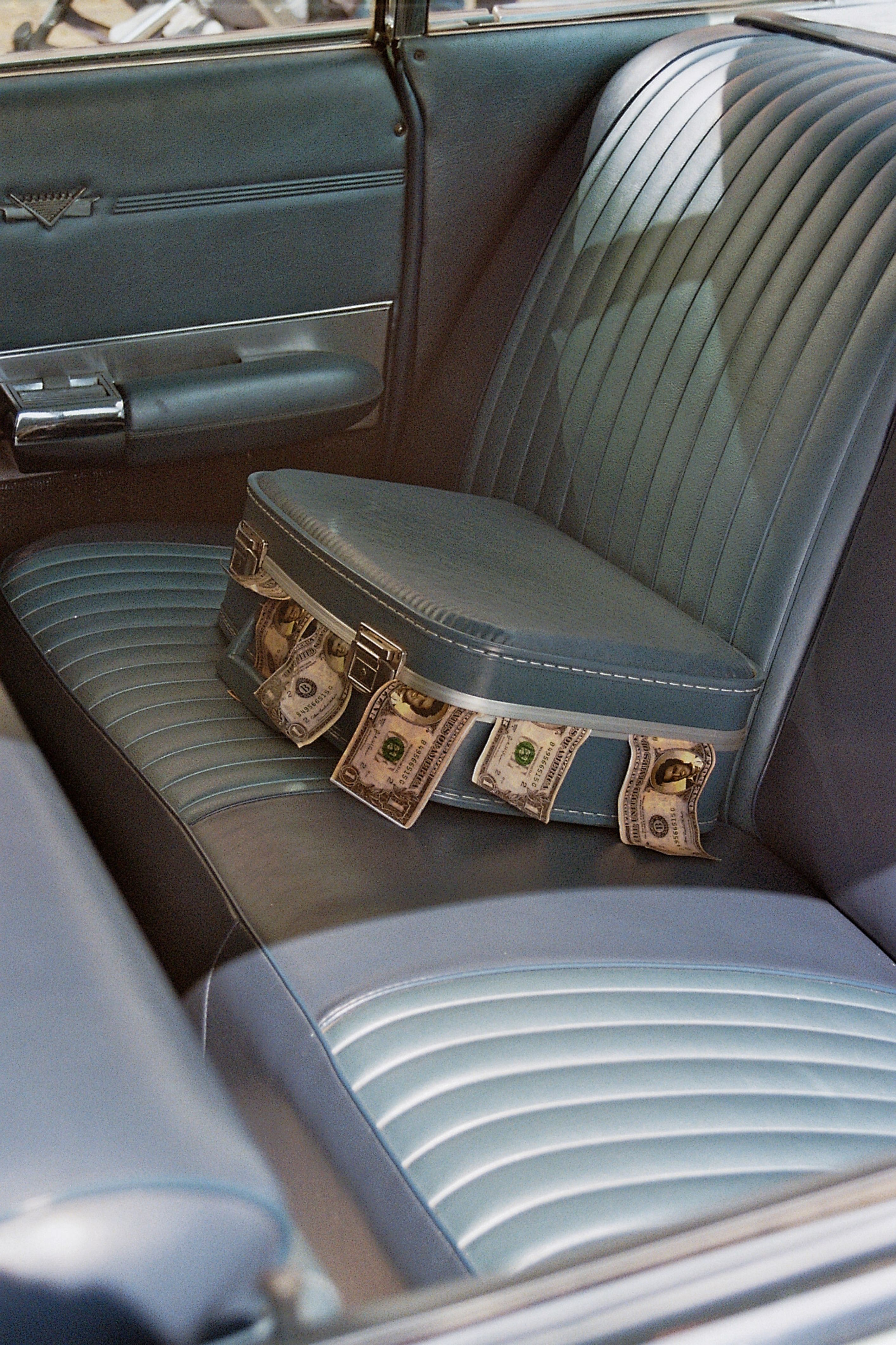 Vintage Car with Money-Stuffed Suitcase Interior · Free Stock Photo