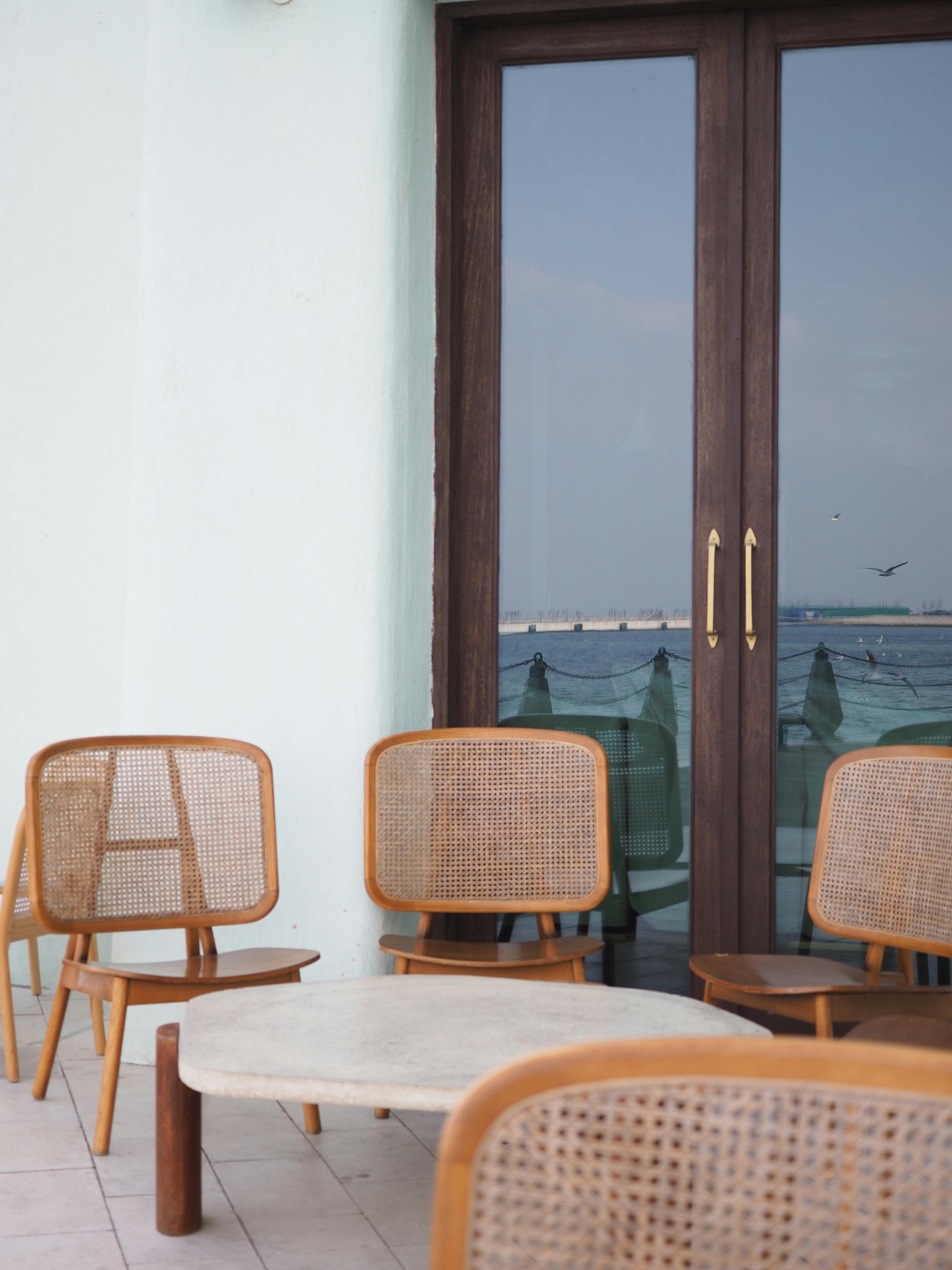 Modern Outdoor Seating Area Overlooking Sea in Doha · Free Stock Photo