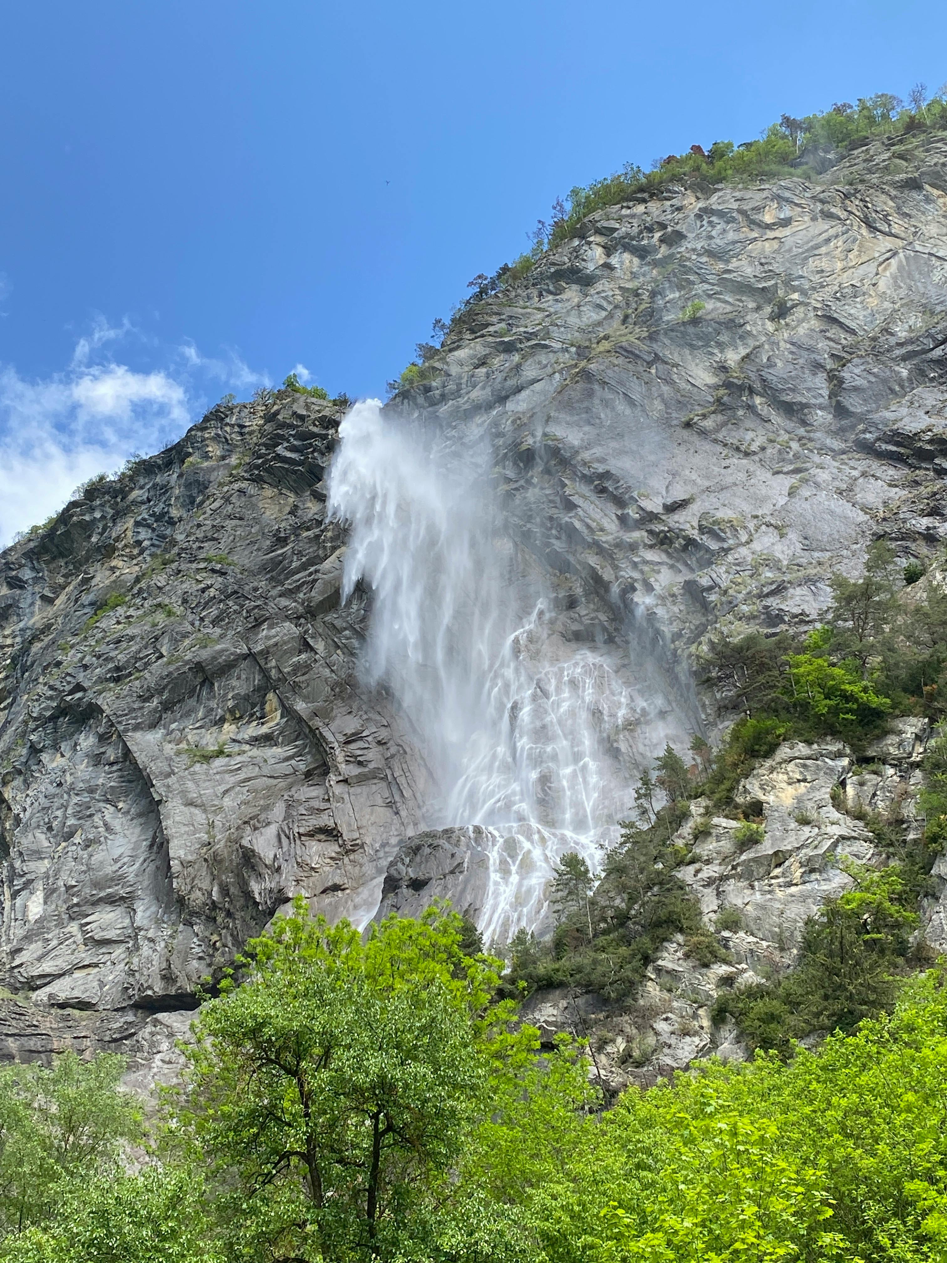 Stunning Swiss Waterfall in Lush Mountain Setting · Free Stock Photo